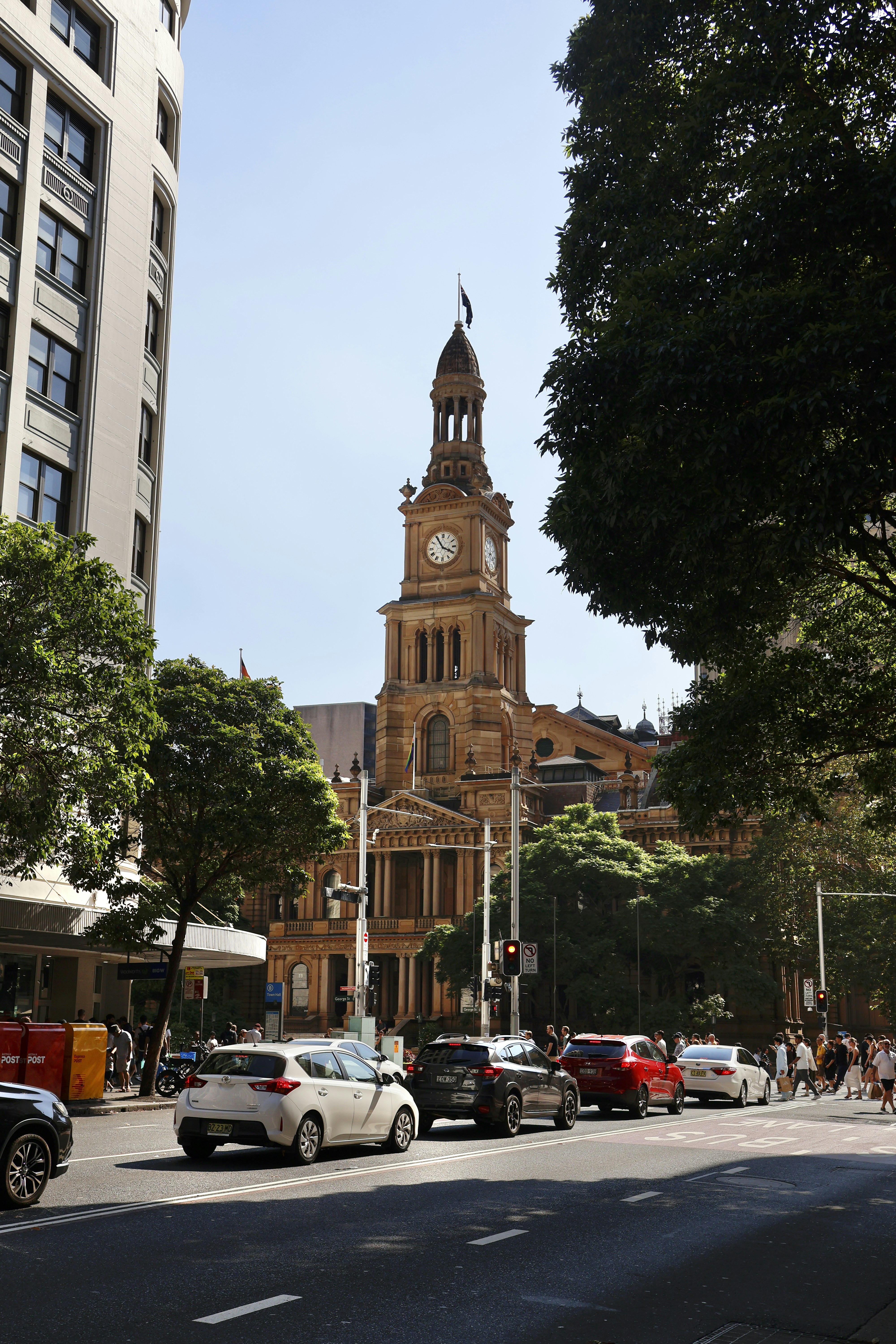 Clocktower Vista: City Street Framed by Architecture and Trees