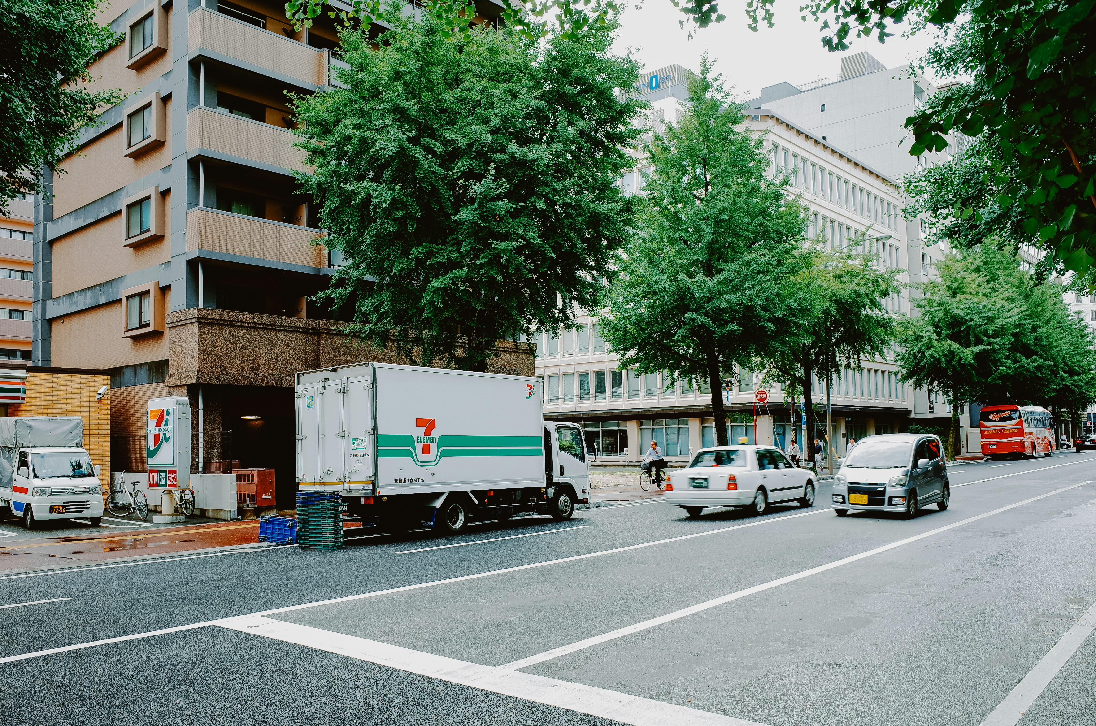 City Street in Motion: A Delivery Truck Beside a Quiet Crosswalk