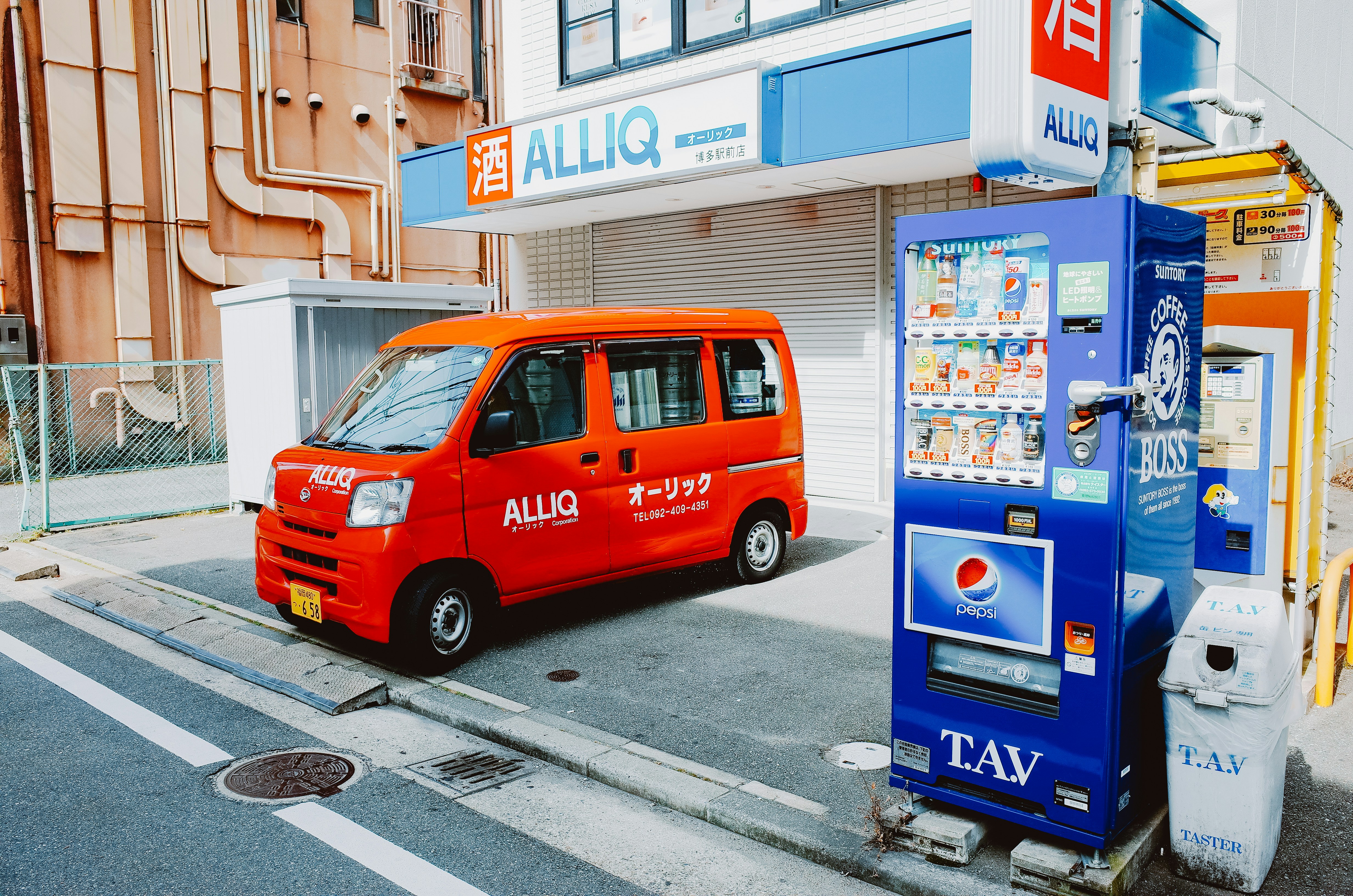 Red Delivery Van at a Bright City Corner