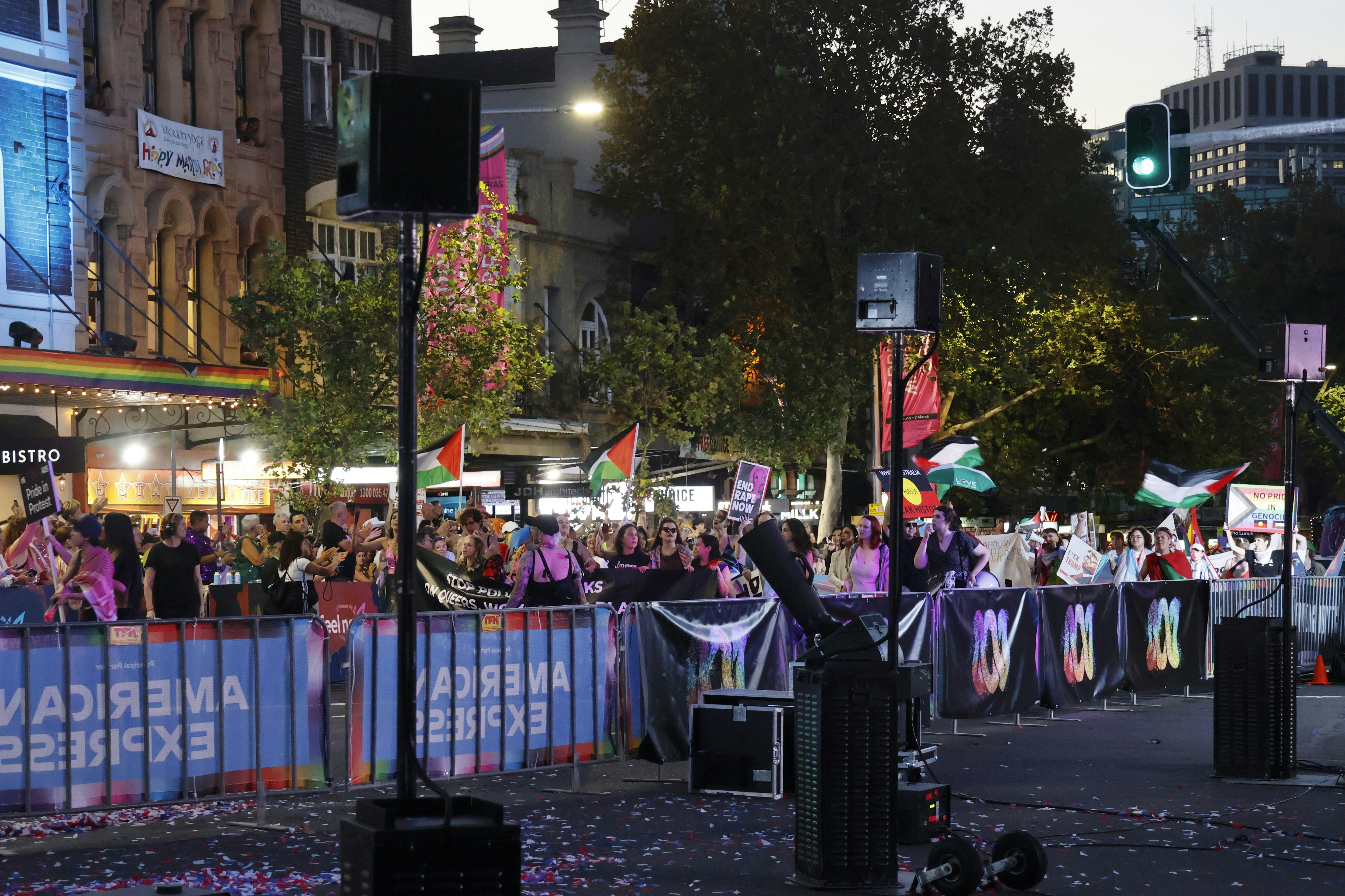 Vibrant Street Parade Banners and Crowd at Dusk