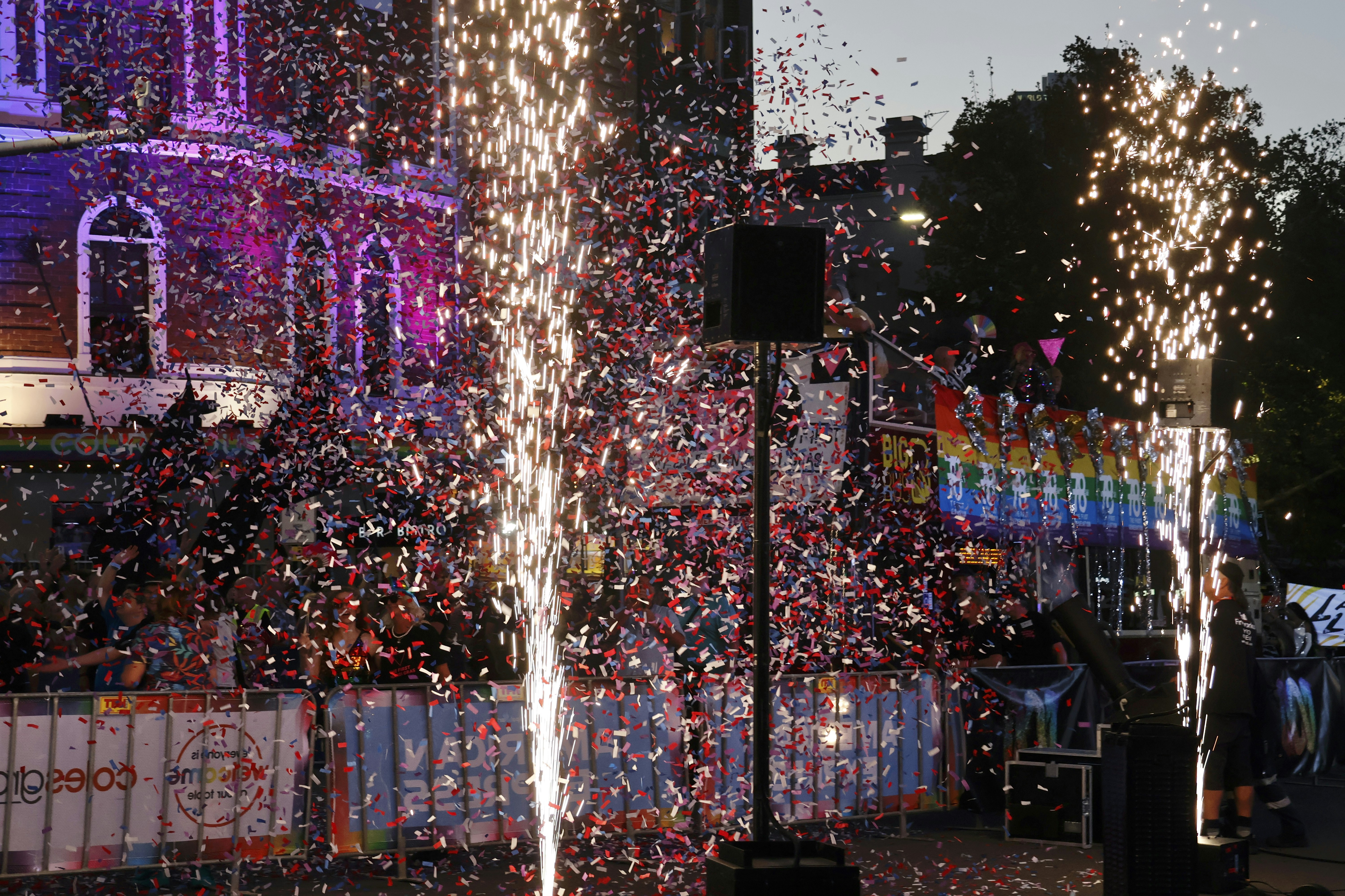Fireworks on Parade: Confetti Cannon Illumination Over a Festive Street