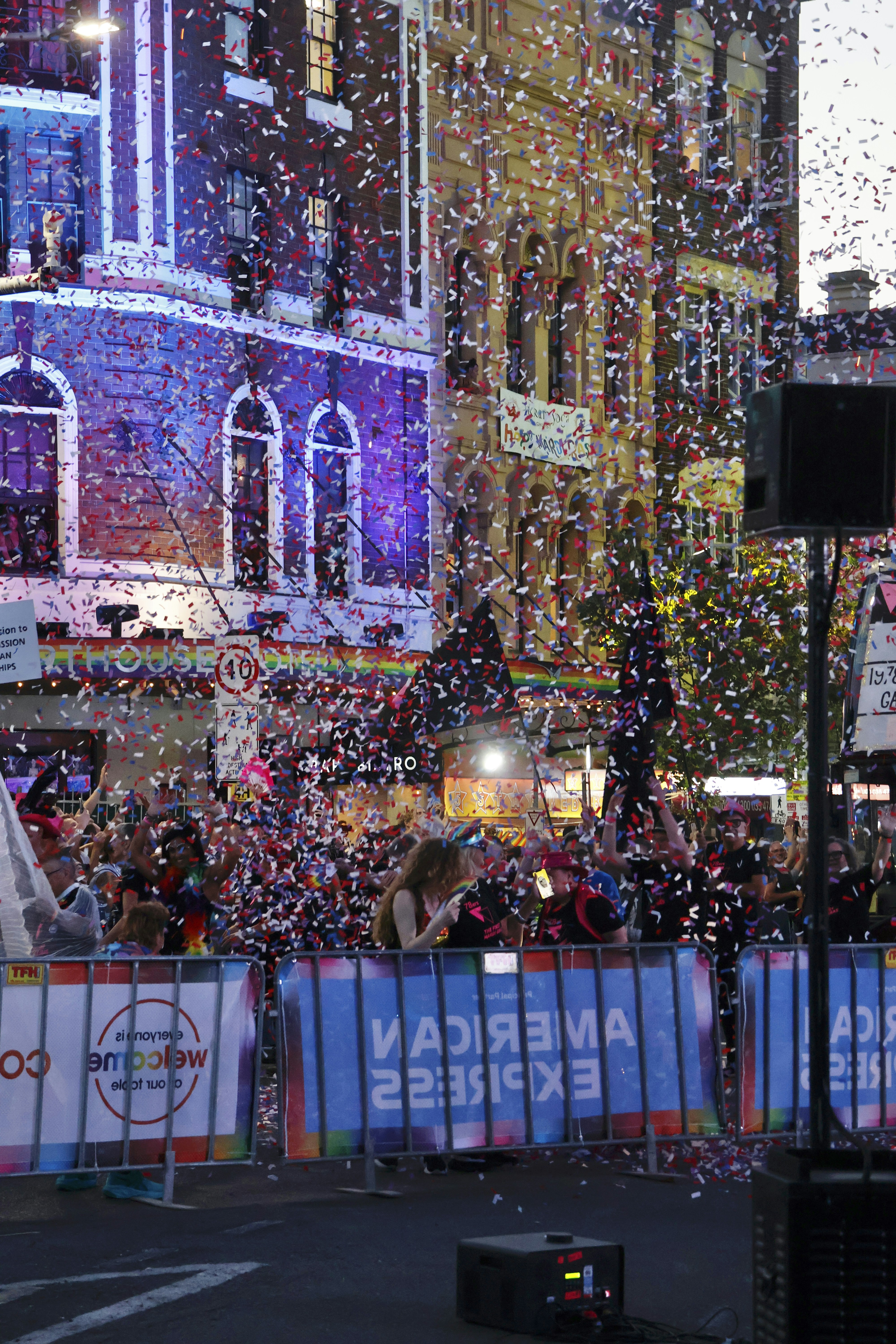 Confetti Rains on a Nighttime Parade Street