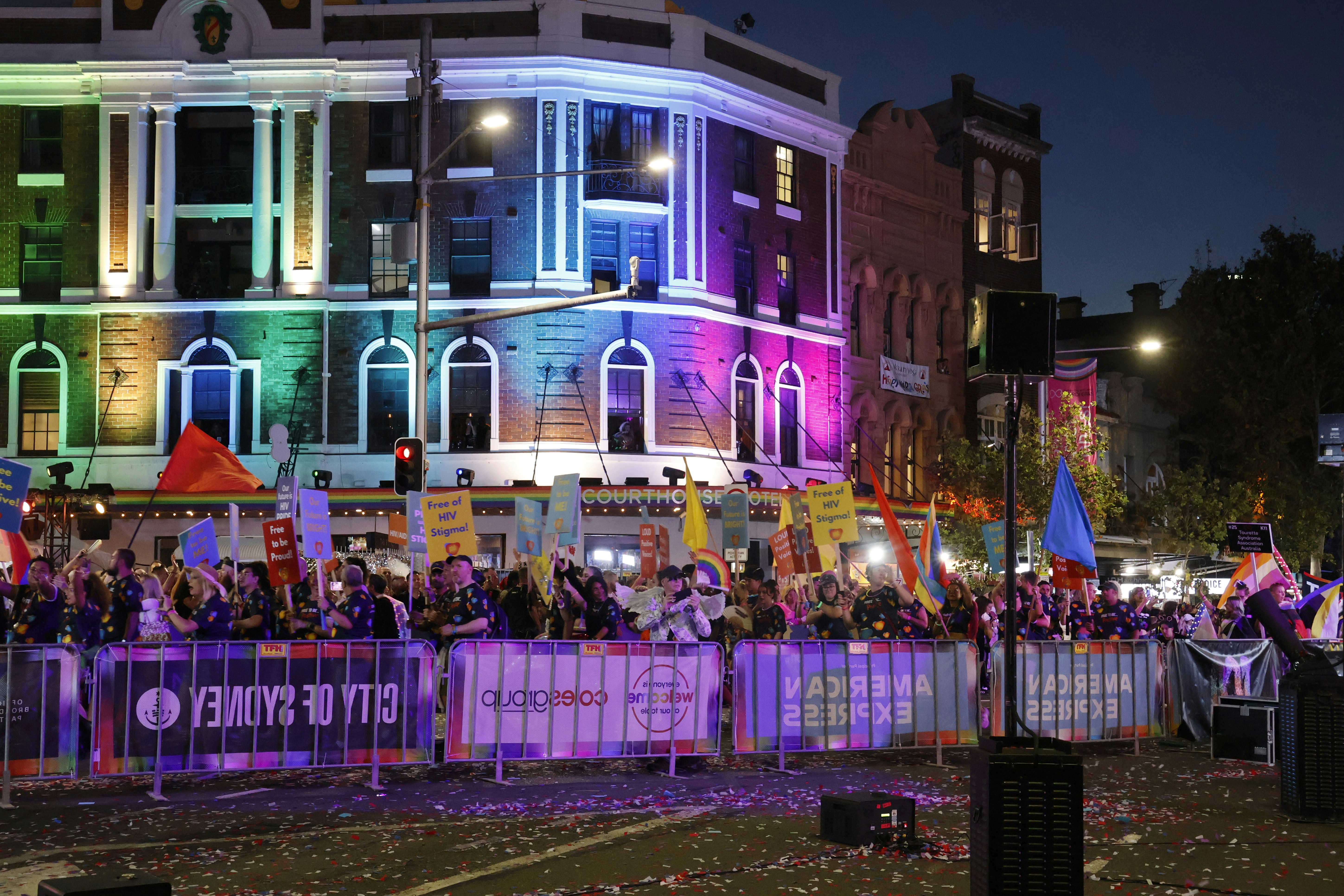 Neon Facade Illuminates a Night Parade