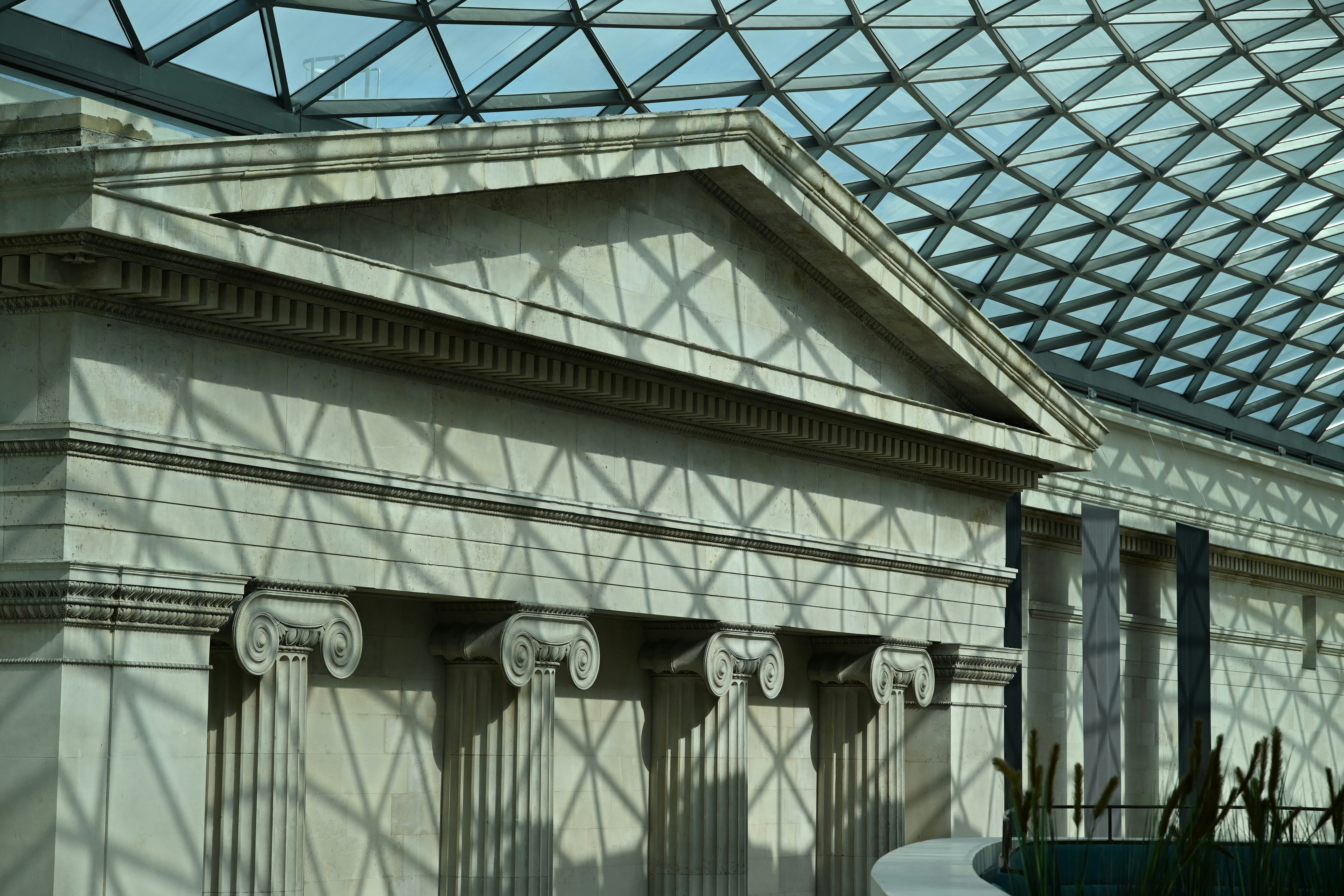 Geometry of Glass and Columns: Dawn Over an Atrium Facade