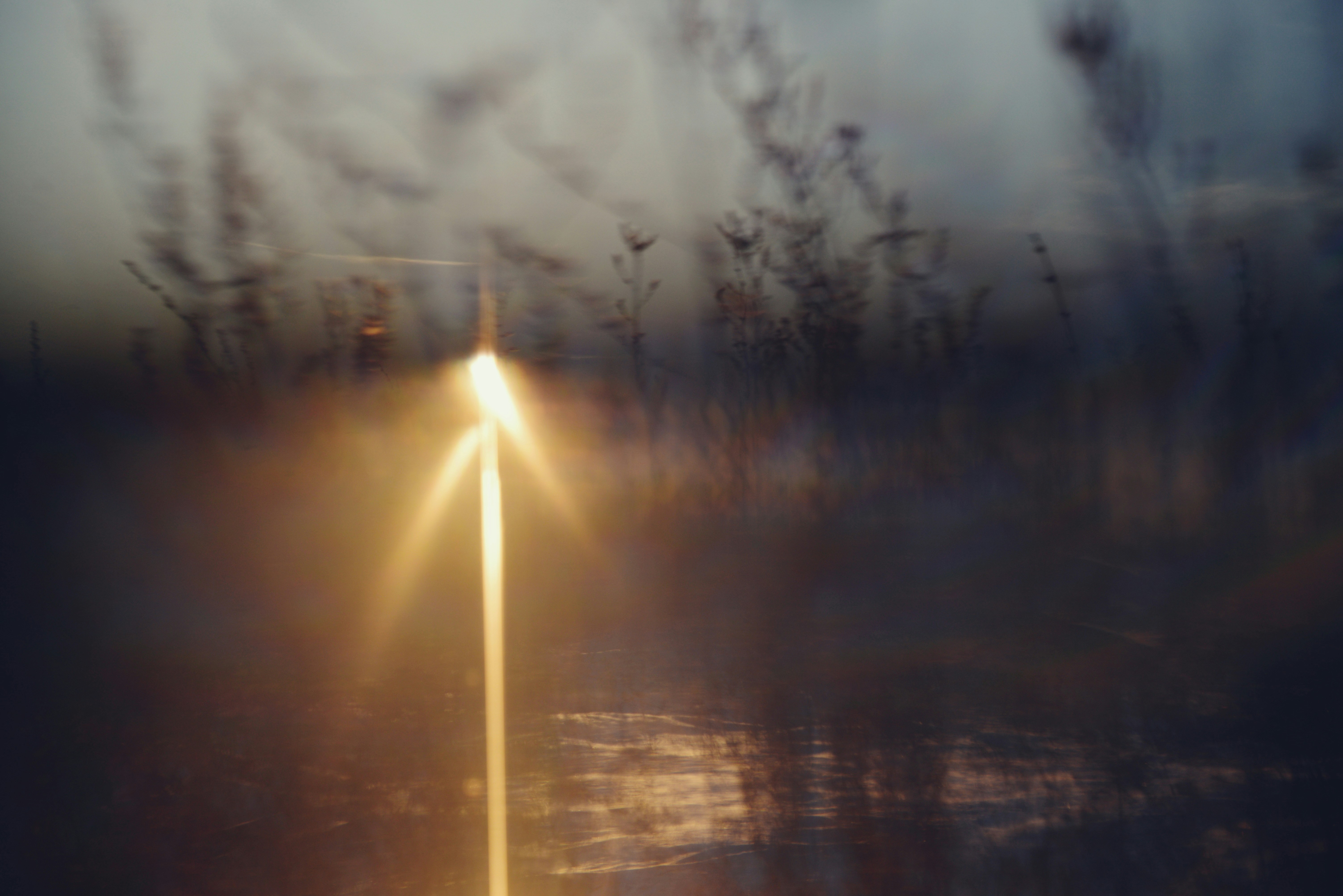 Ghostly Beacon over a Misty Wetland