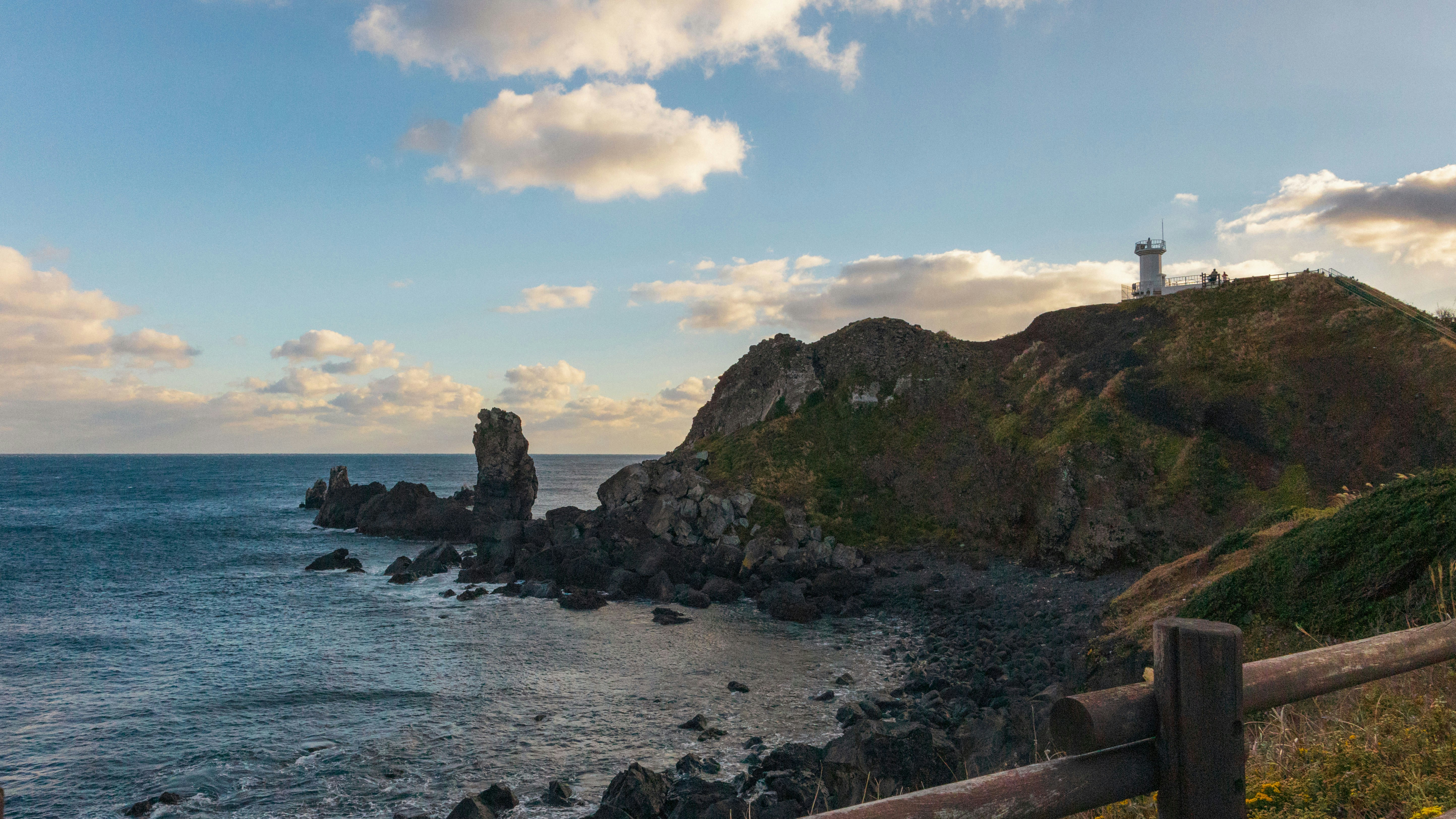 Cliffside Beacon: A Lighthouse Standing Watch Over the Sea