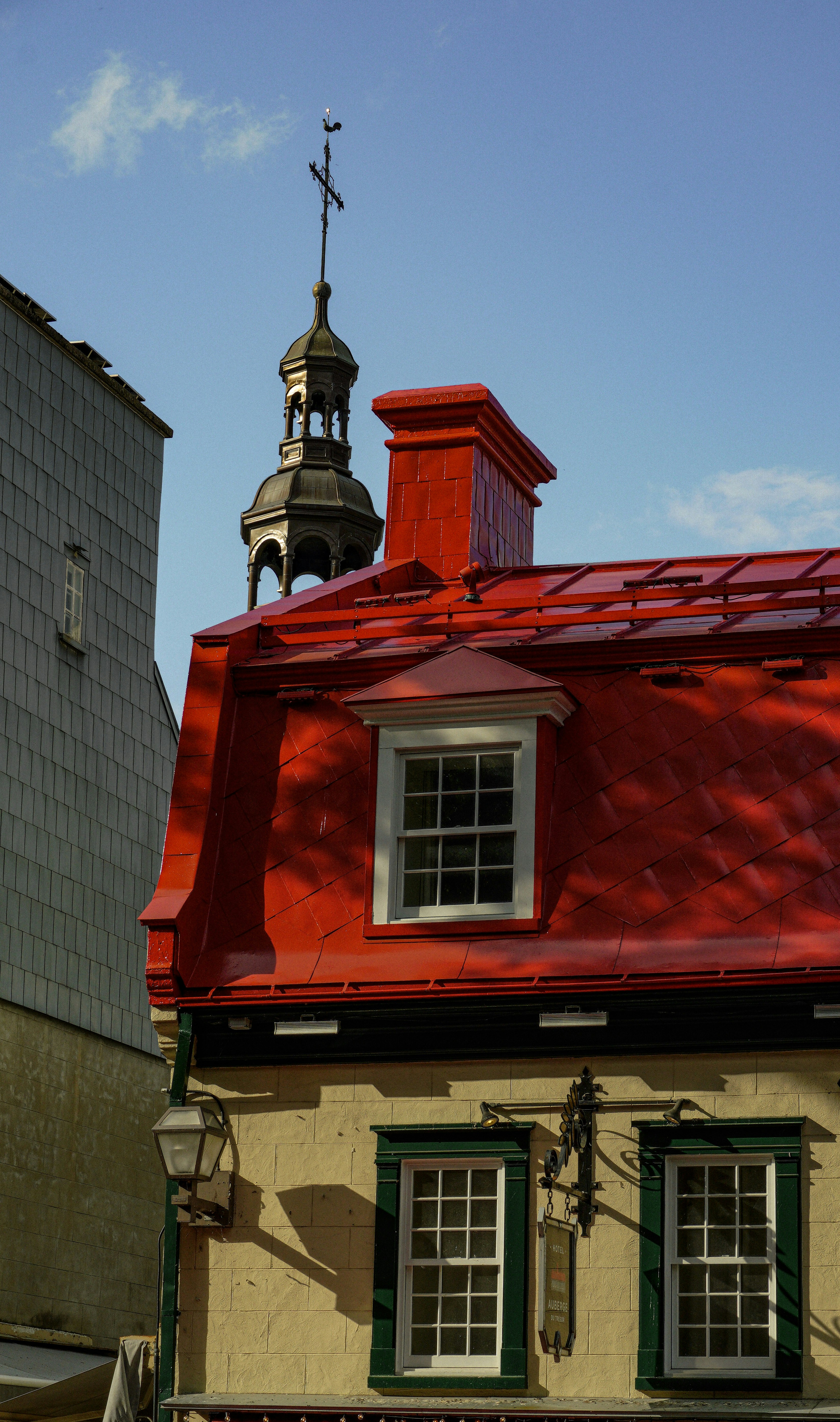 Rooftop Red: A Tale of Architecture and Shadows