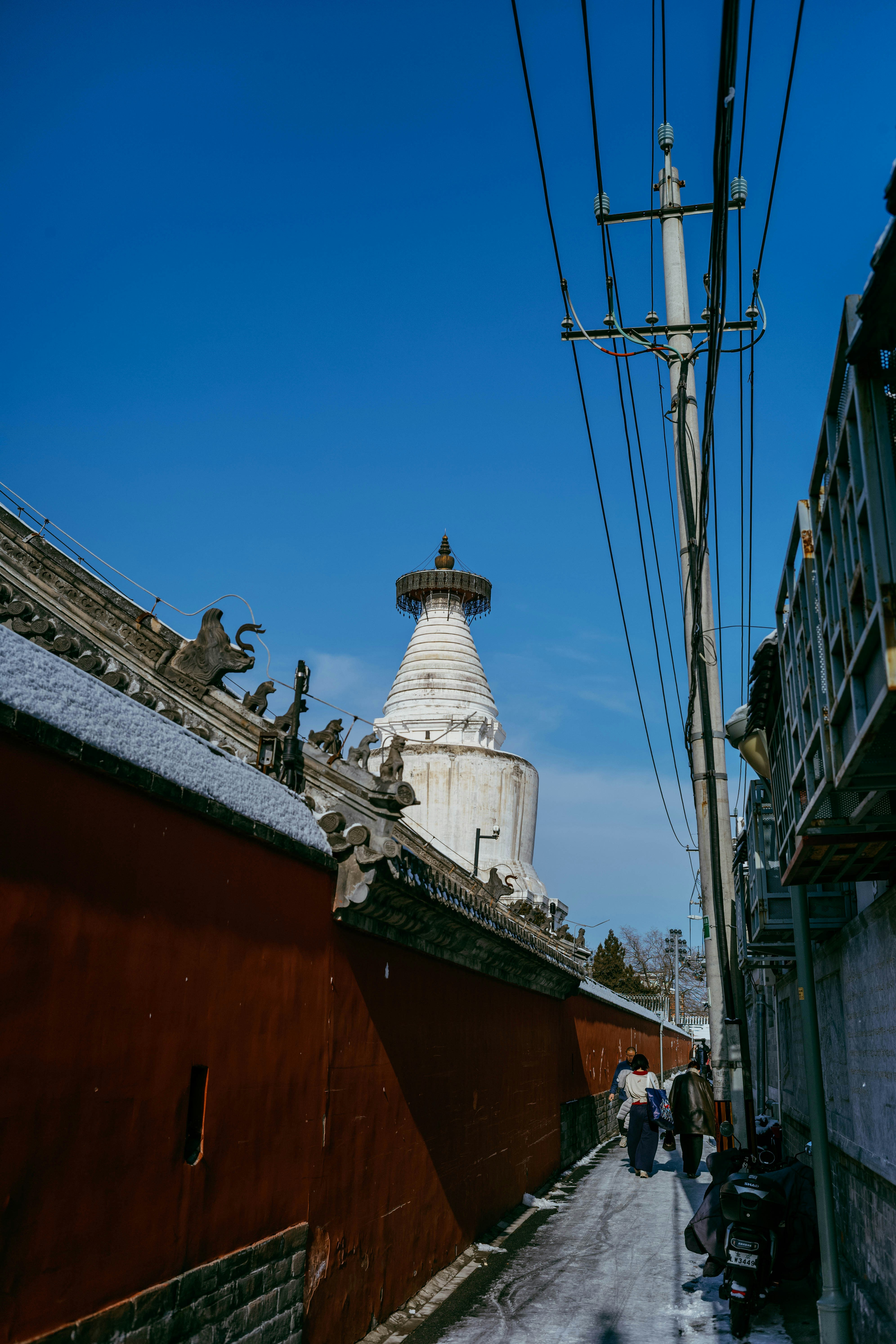 Prayerful Skyline: A Narrow Street Lead to the White Stupa