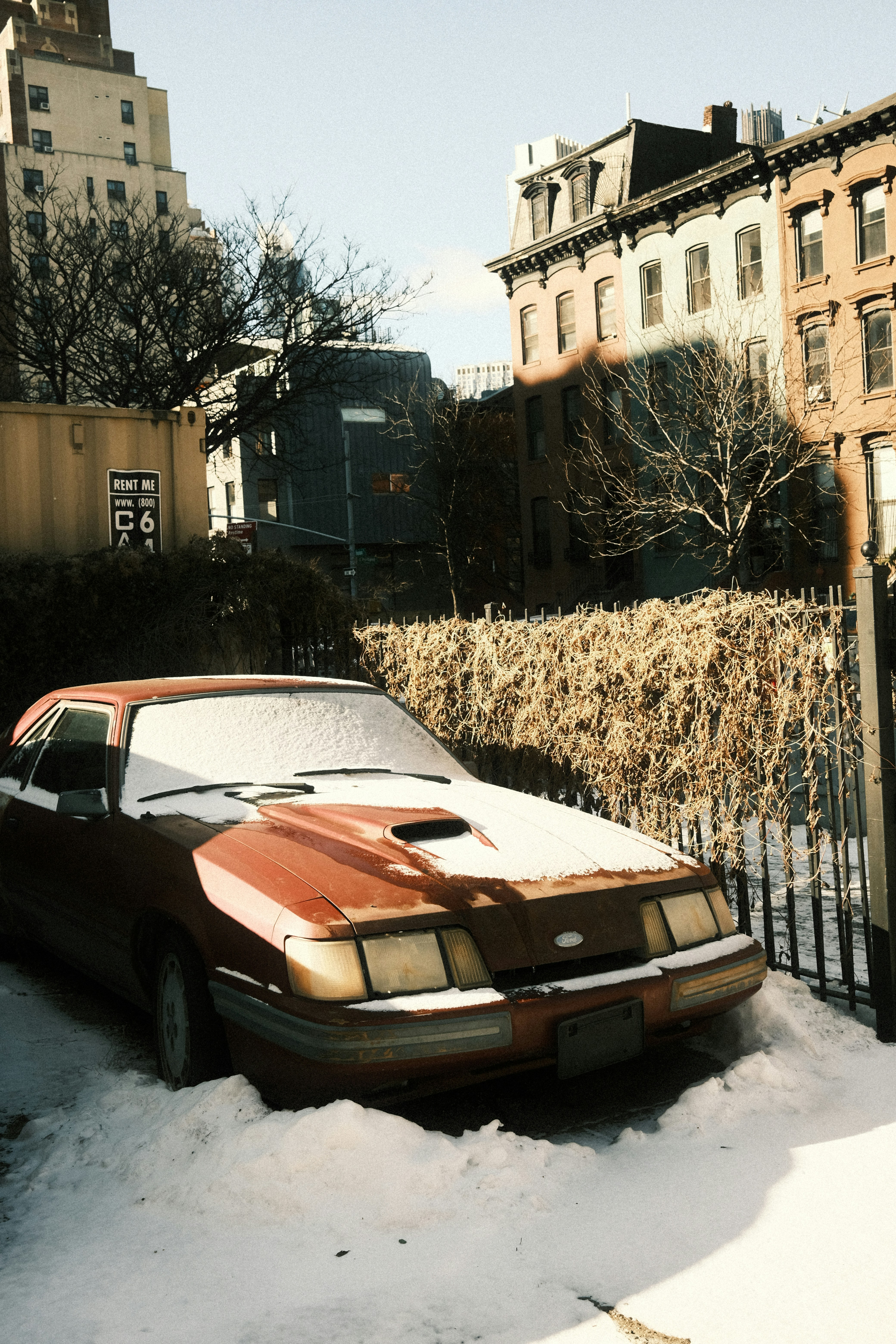 Snow-Blanketed Classic Car in Urban Quiet