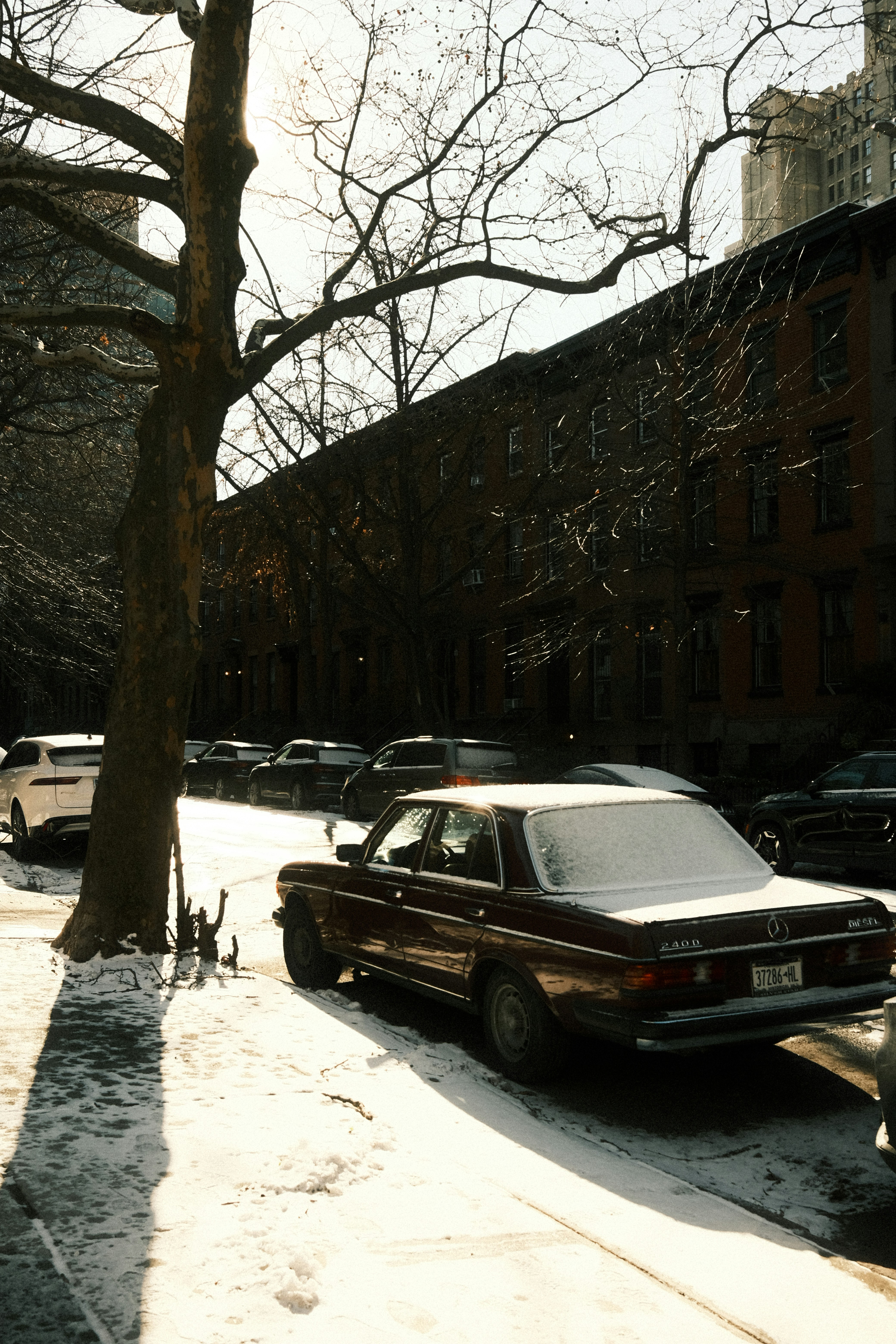 Snowlit Street Symphony: Classic Mercedes Amid Winter Shadows