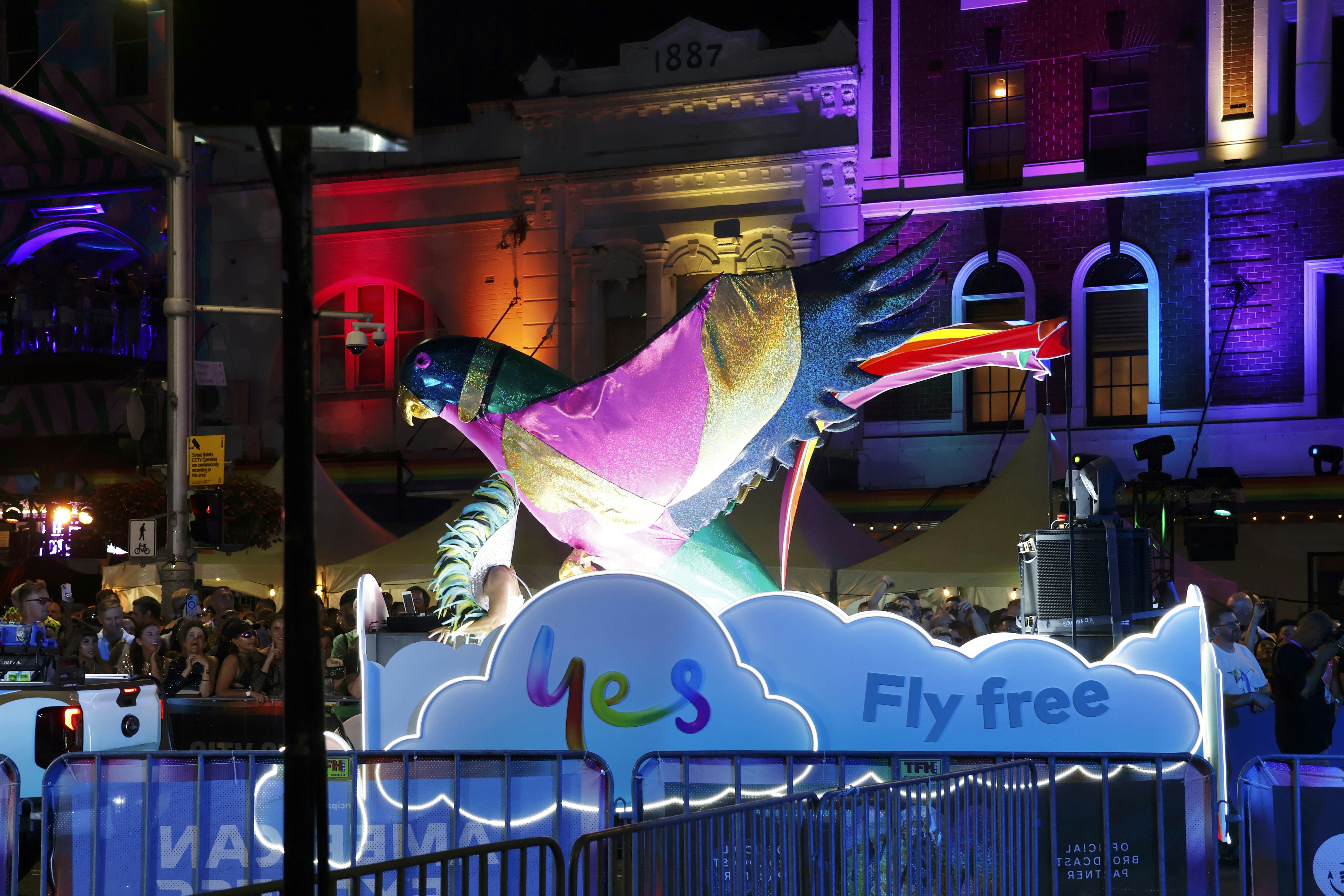 Color-Splashed Night Dragon Parade Under Neon Arcades