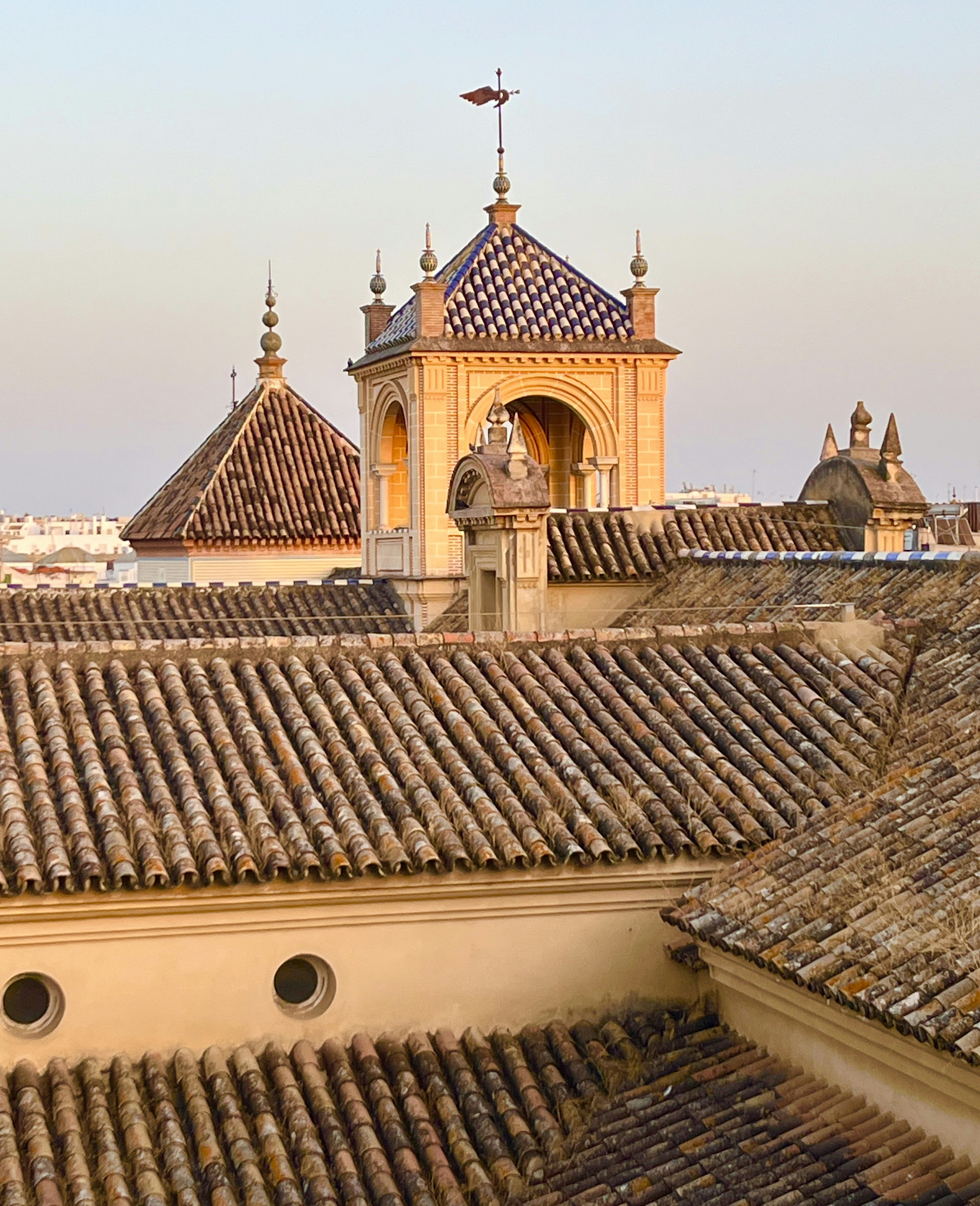 Rooftop Mosaic: A Venetian Clocktower Surrounded by Tile Seas