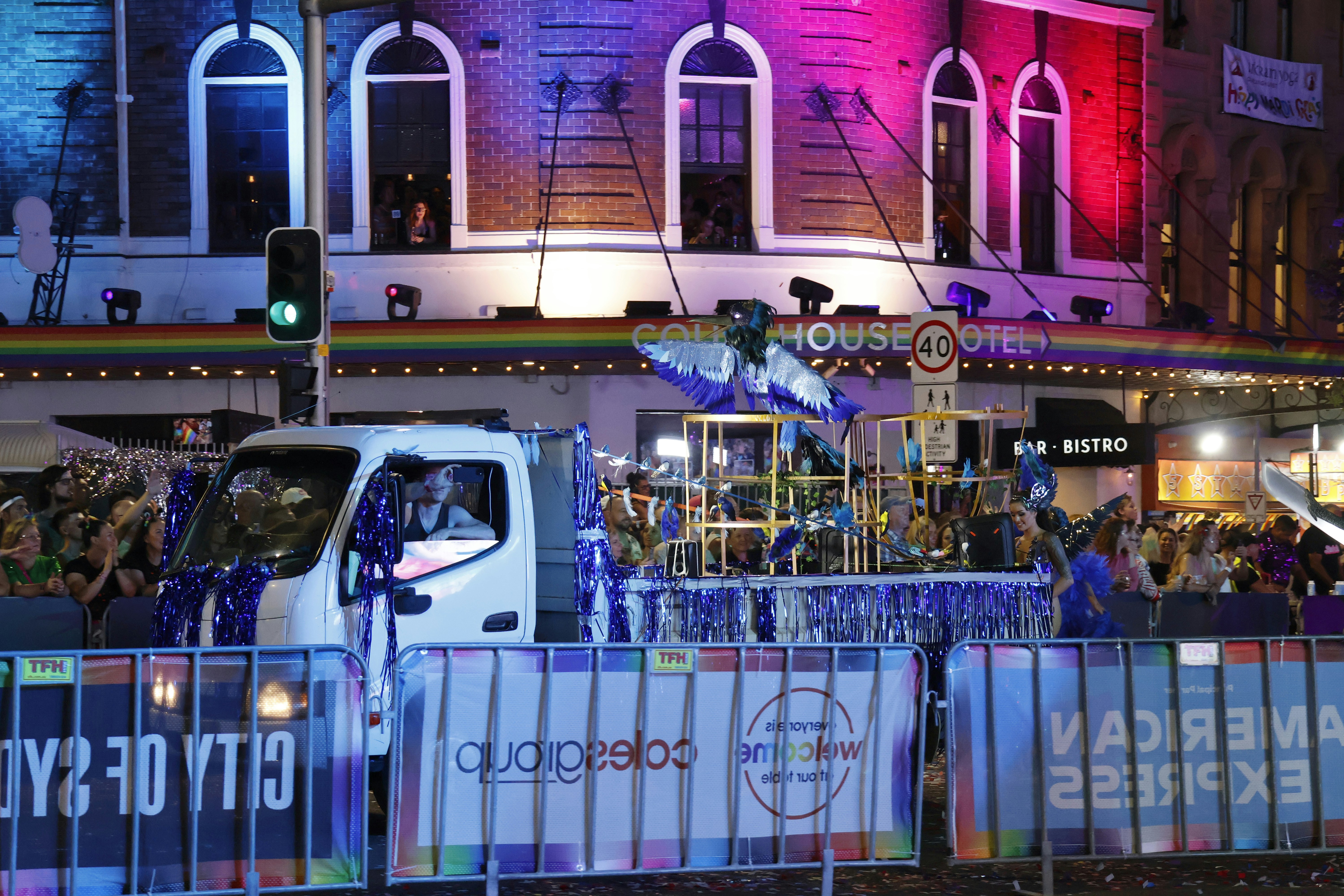 Electric Prow on Main Street: Neon Parade Float Under City Lights