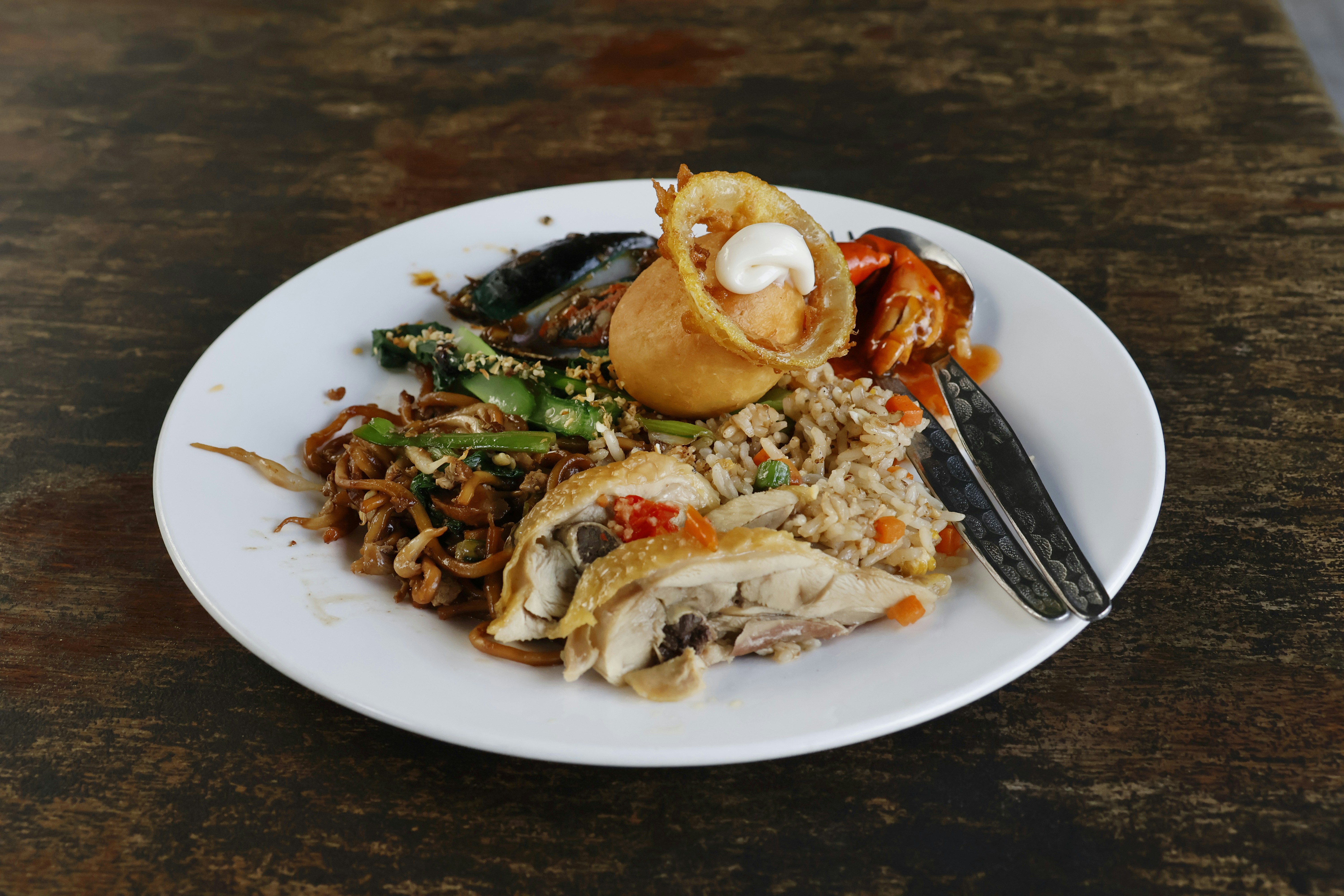 Plate of Mixed Asian-style Dishes with Crispy Roll and Noodles