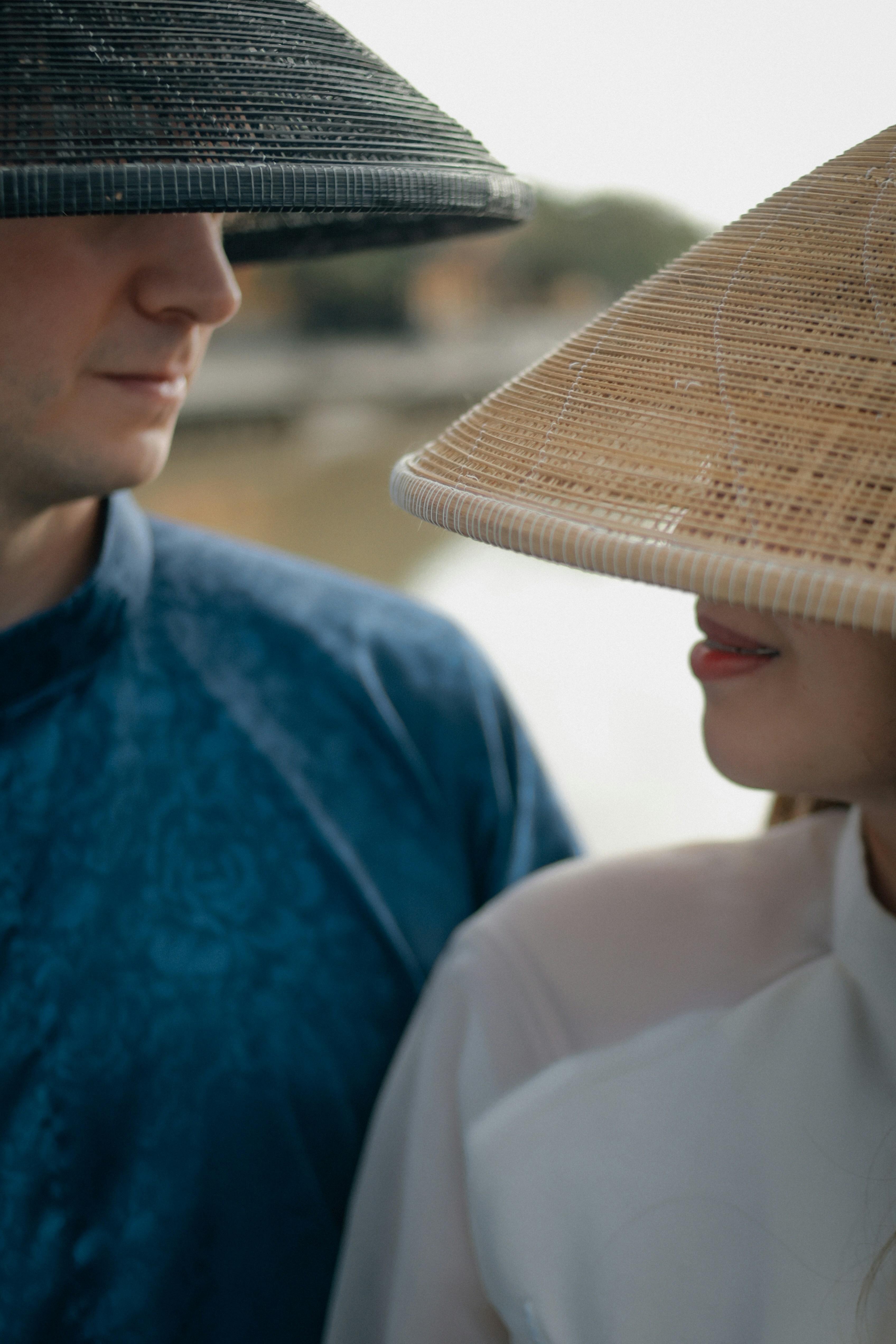 Whispered Connections under Wide Straw Hats