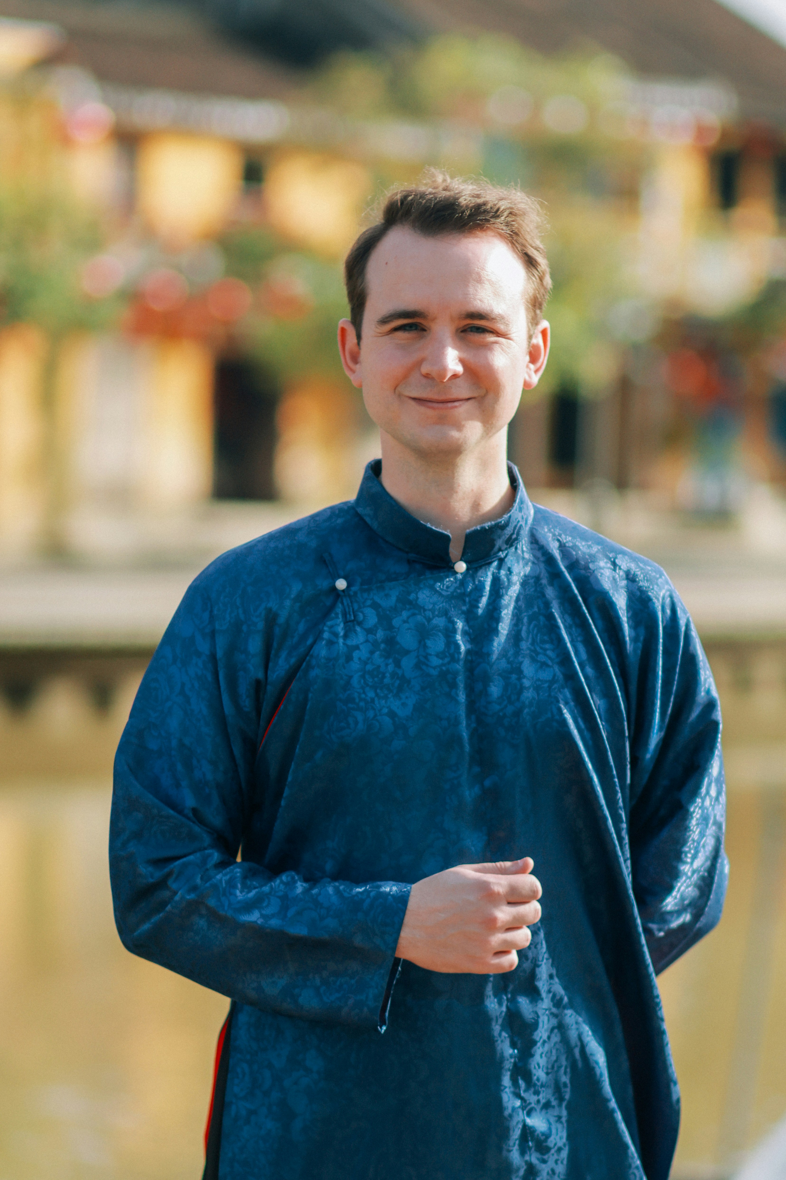 Portrait in Soft Focus: A Suave Smile Amid Warm Archive Architecture