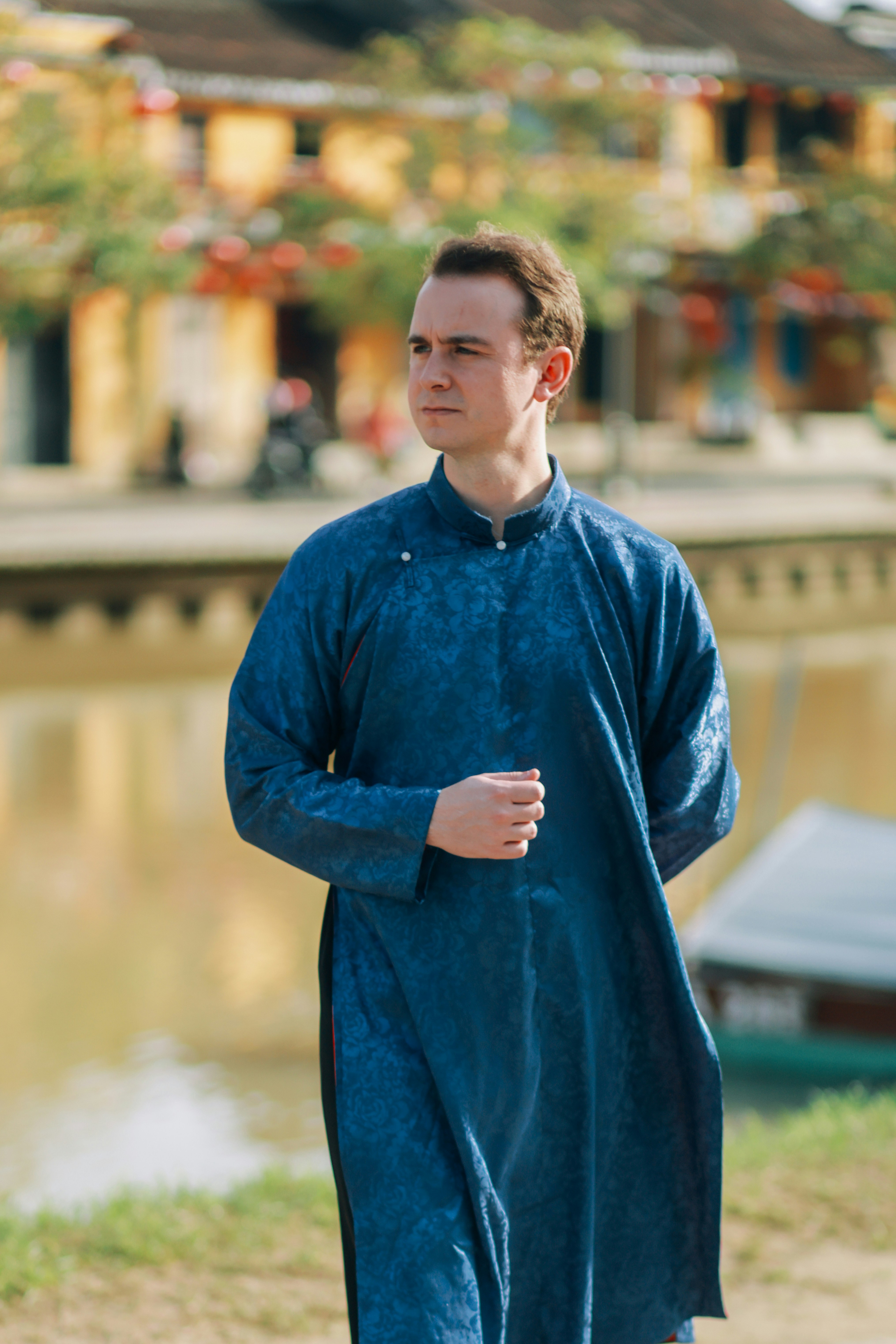 Portrait of a Quiet Confidence in a Blue Traditional Tunic by the River