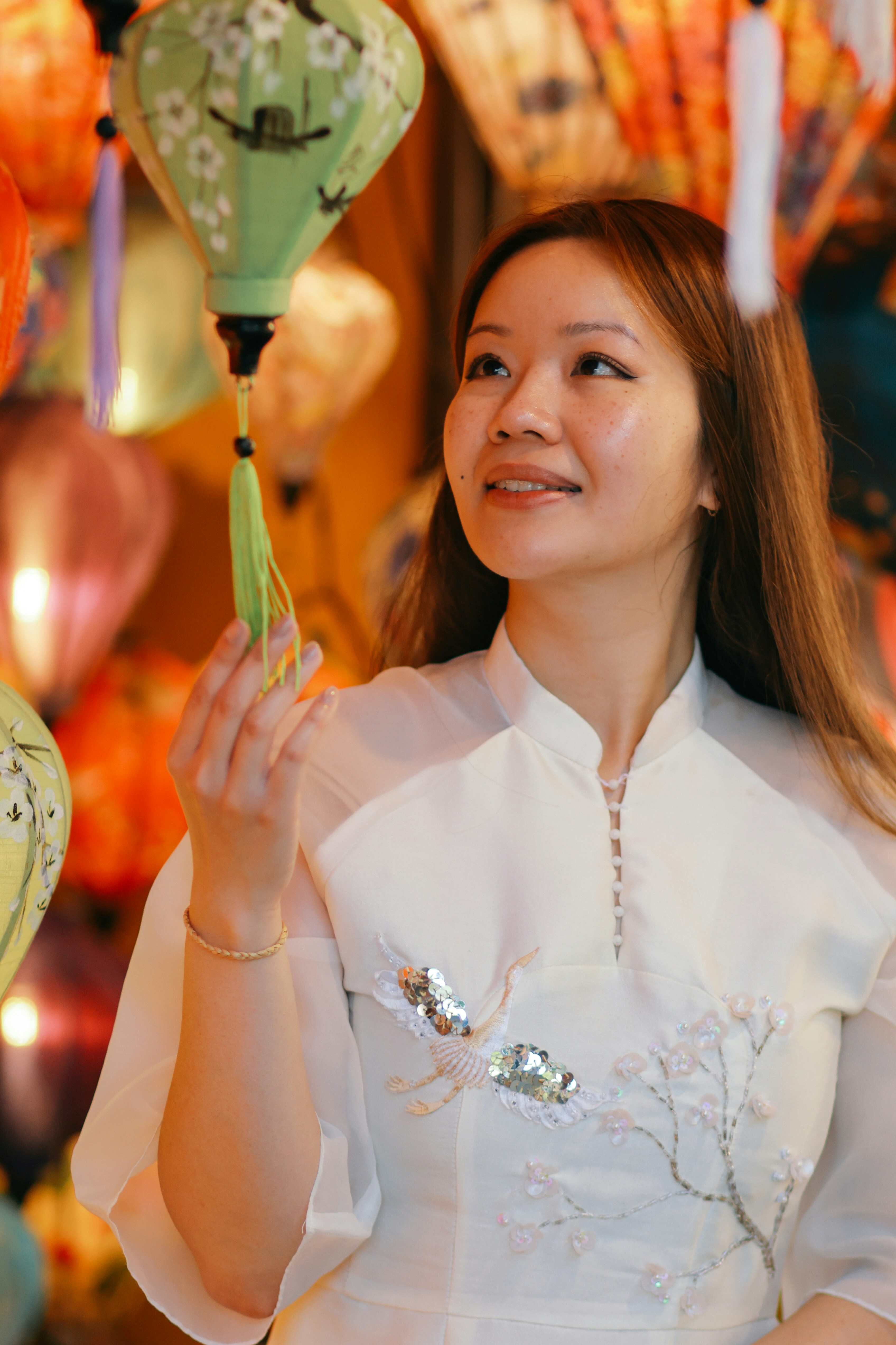 Soft Glow in a Lantern Market: A Portrait among Floating Orbs