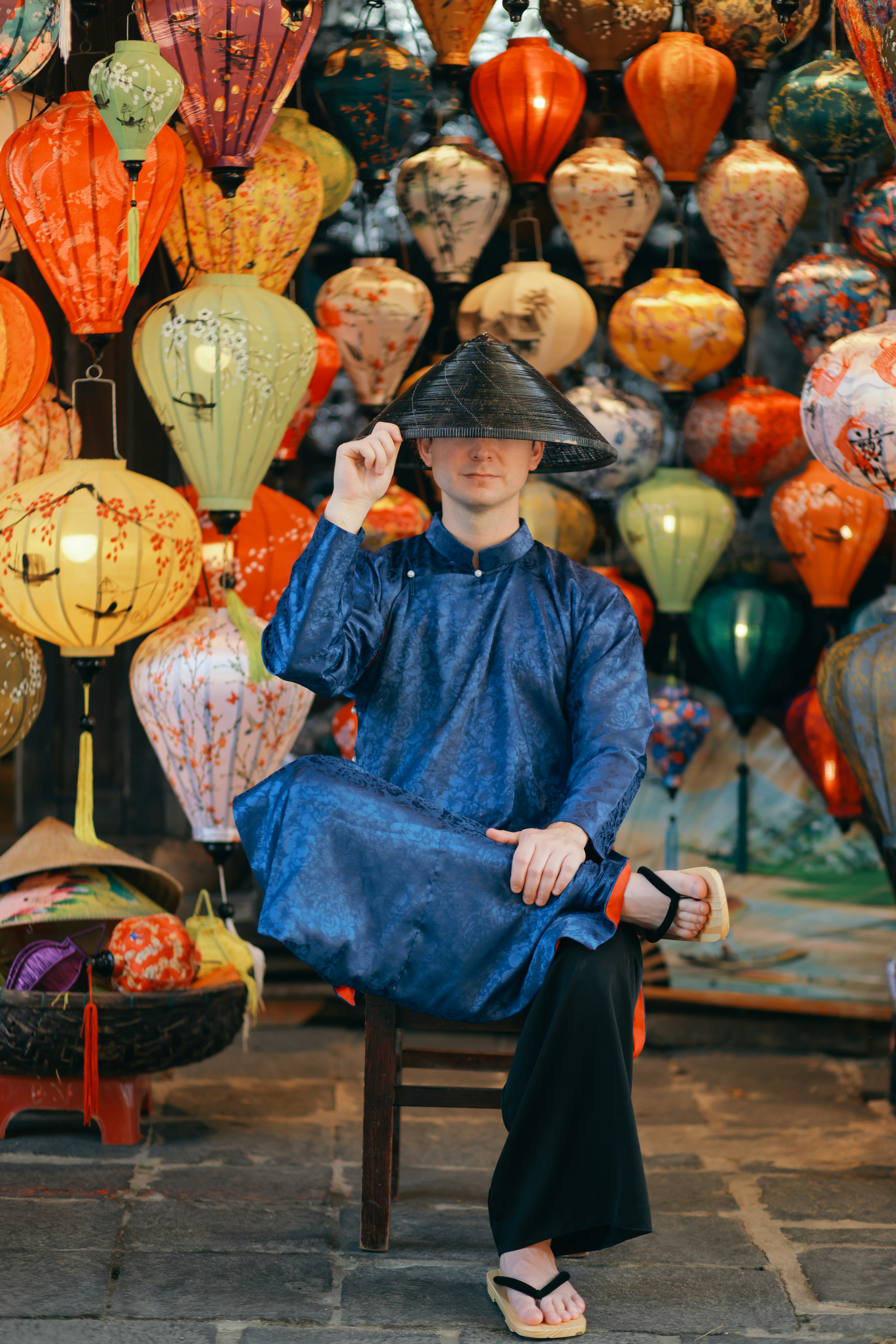 Silent Confidence Beneath a Canopy of Lanterns