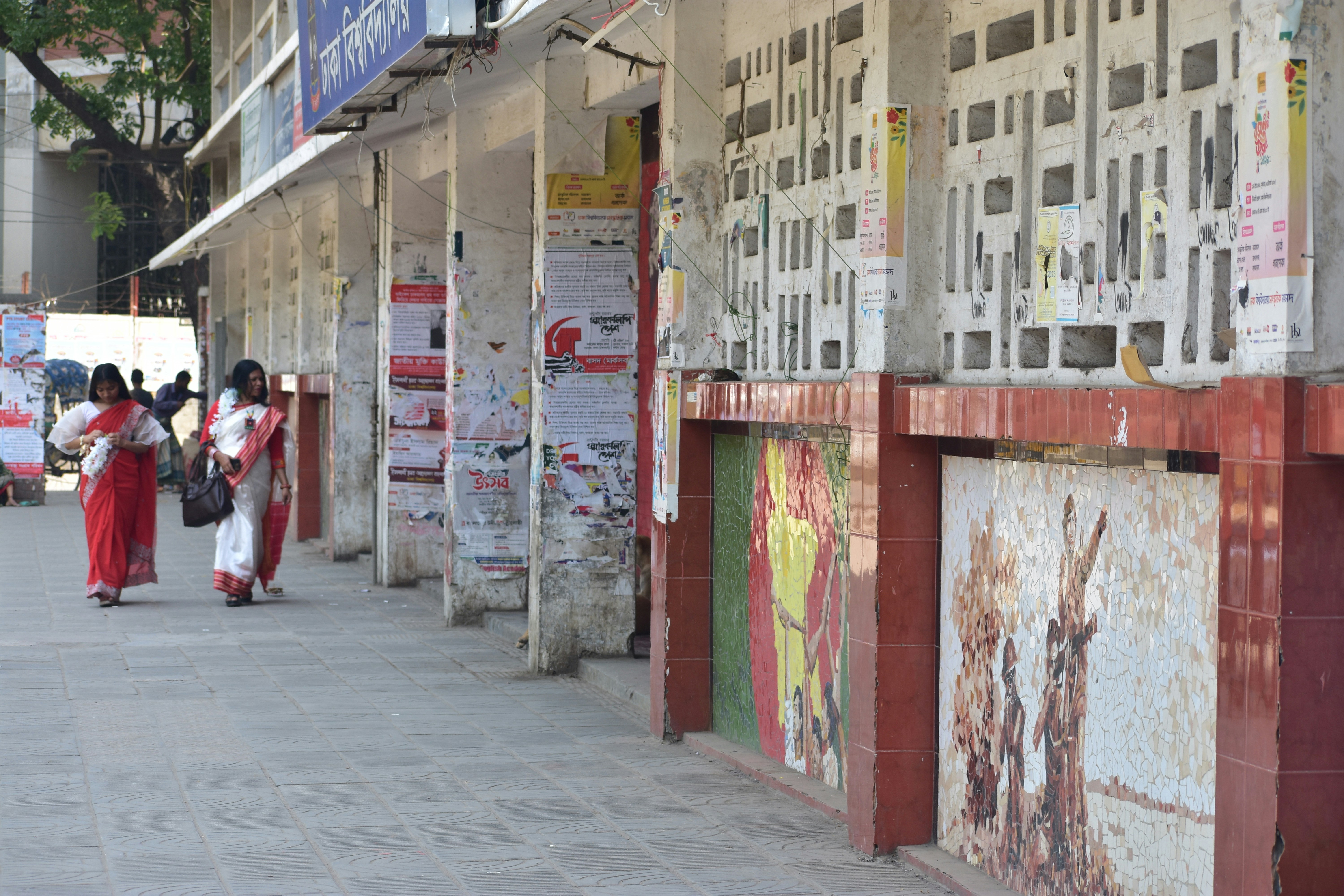 Quiet Temple Street: Women in Saffron and Artsy Wallscapes