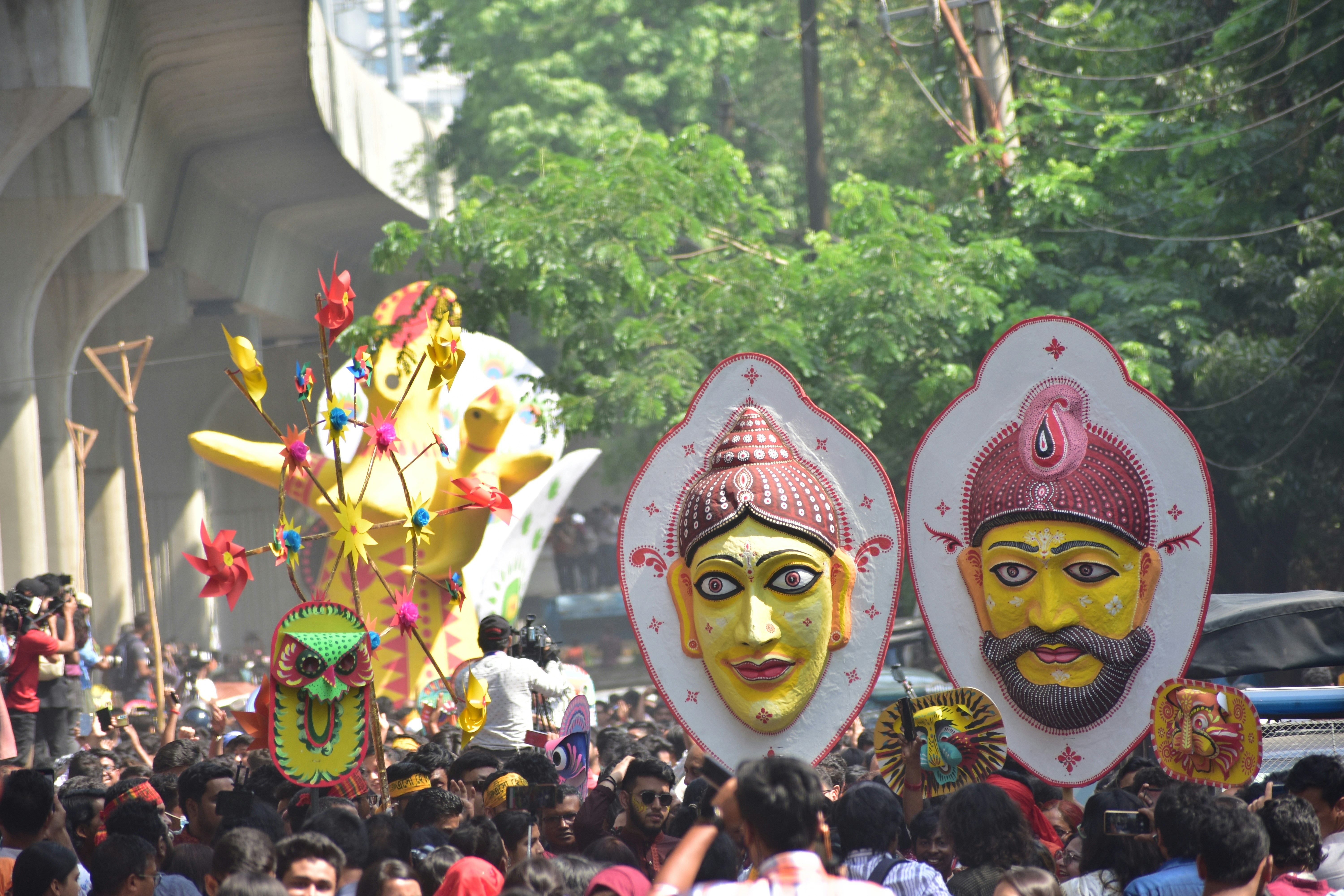 Flight of Color: Giant Masks Rise Over a Sea of Festival Crowds