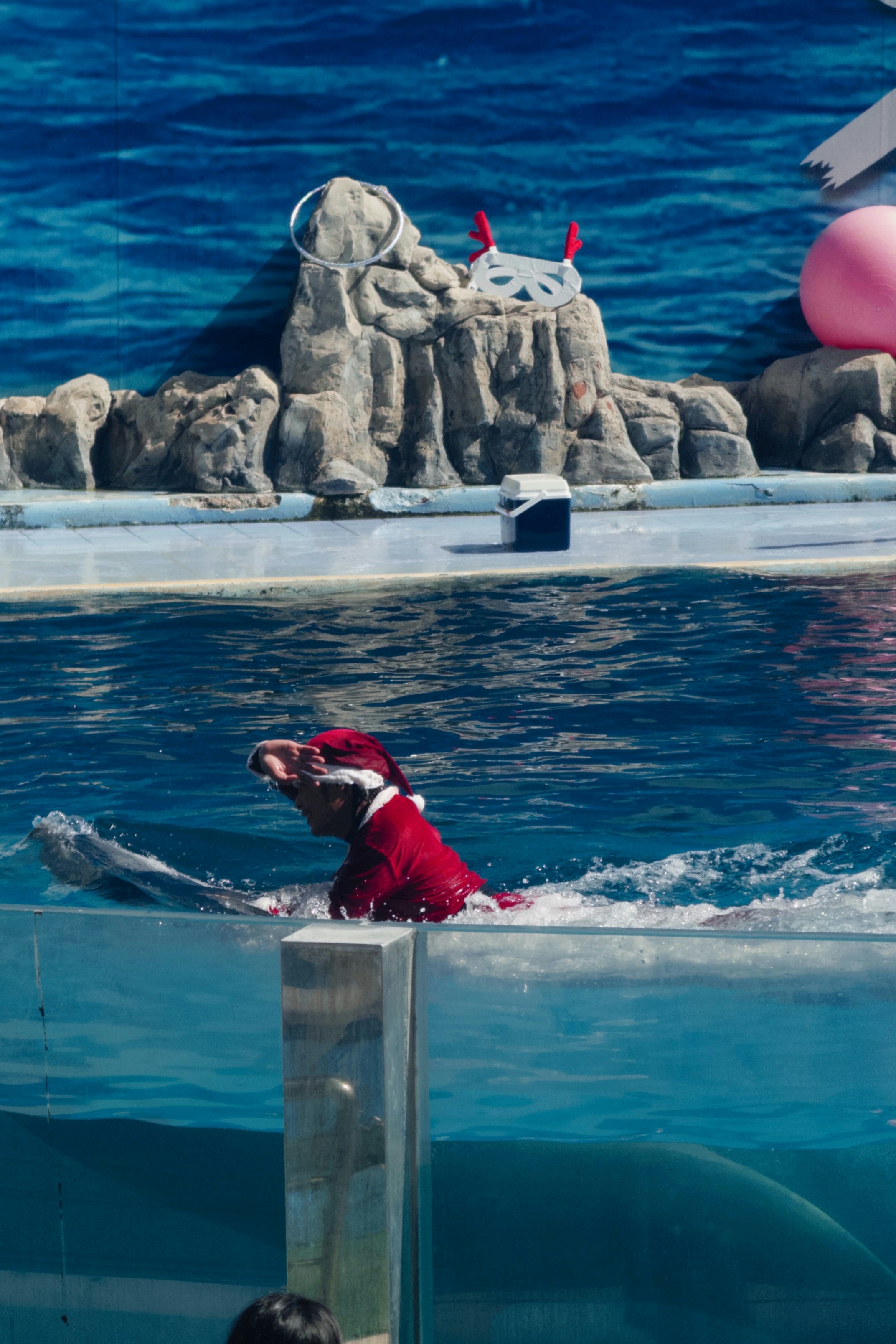 Splashing Santa at the Pool: A Playful Oceanfront Moment