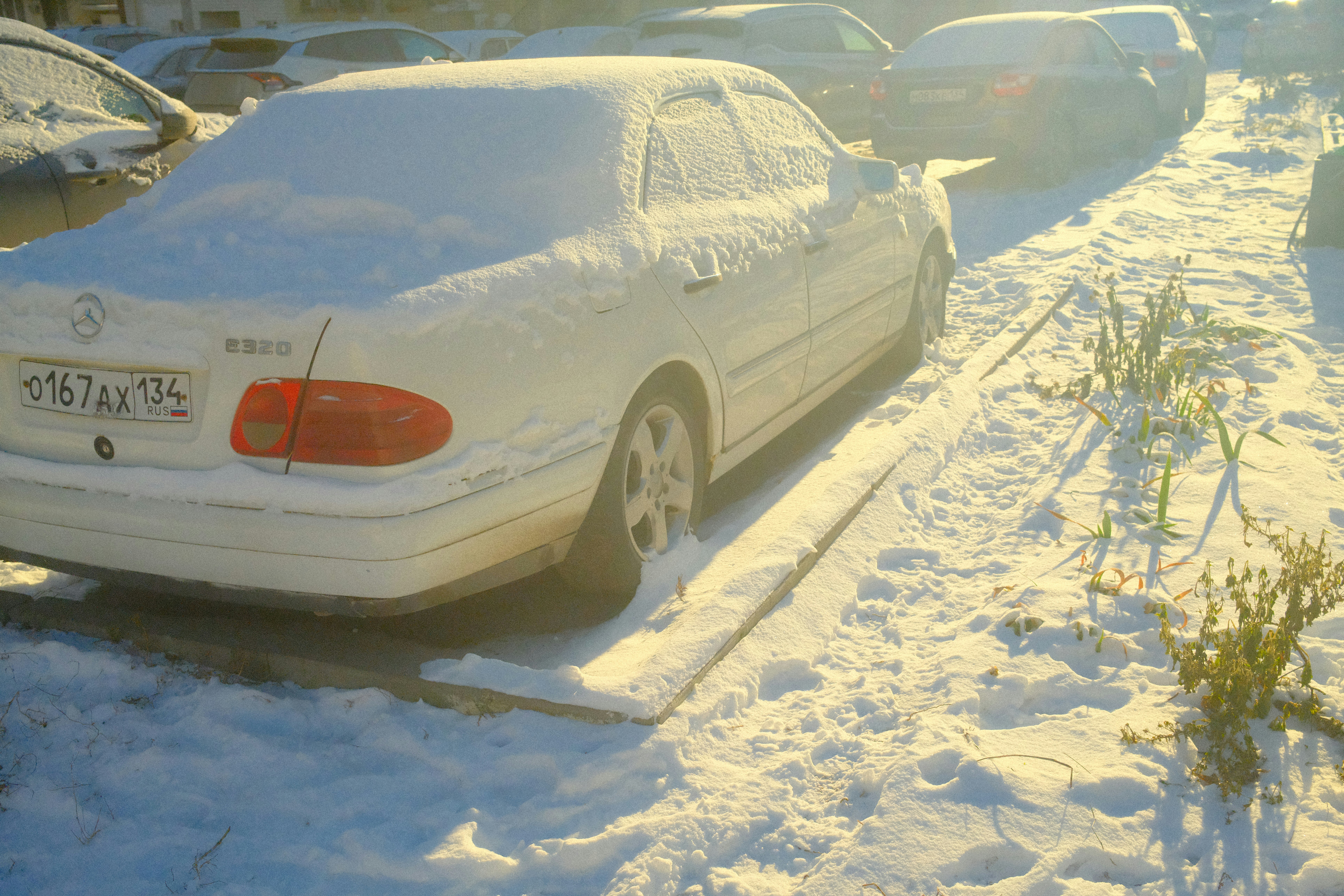 Snowbound Sedan in Morning Light