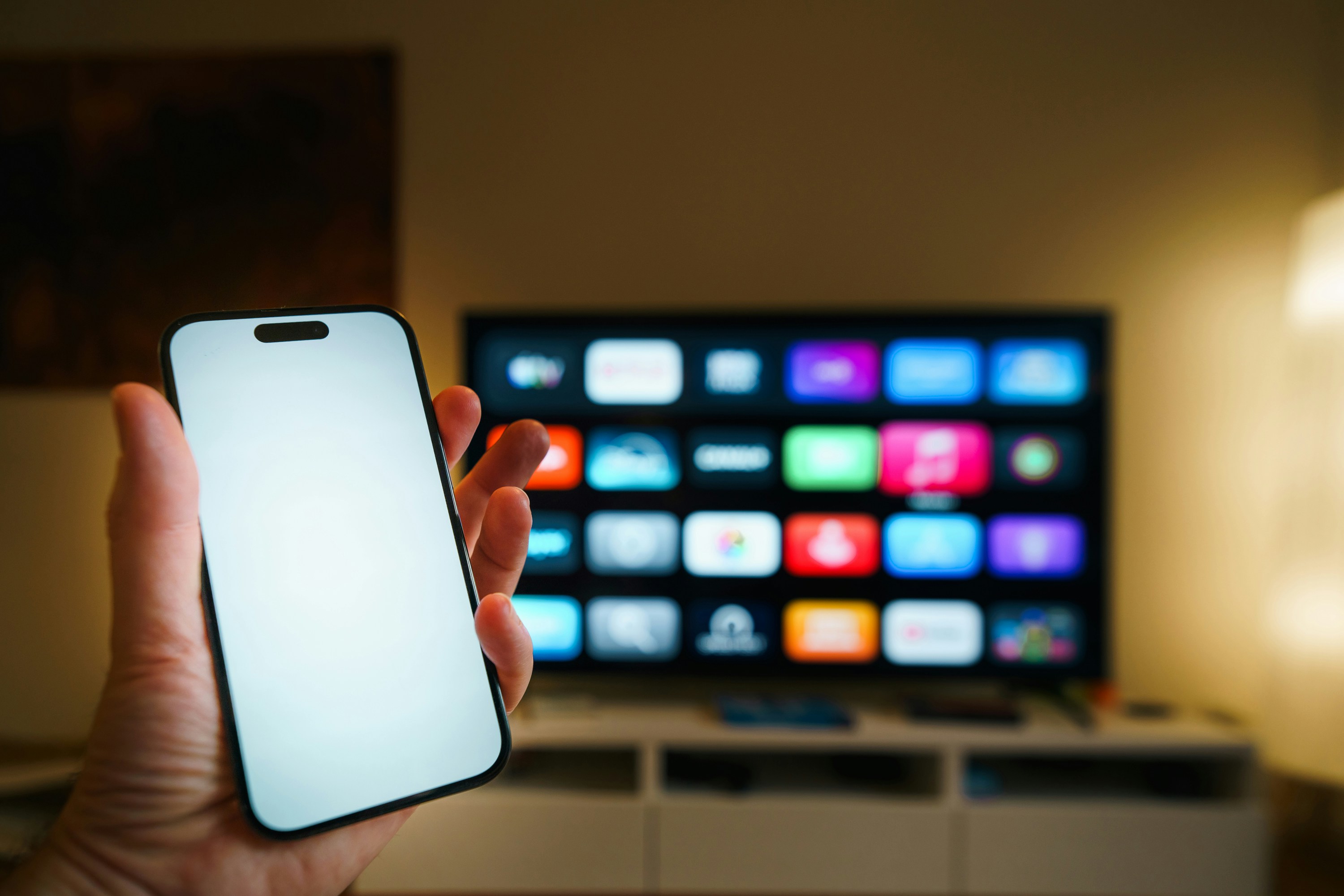 Smartphone held in front of a smart TV screen photo – Free Technology ...