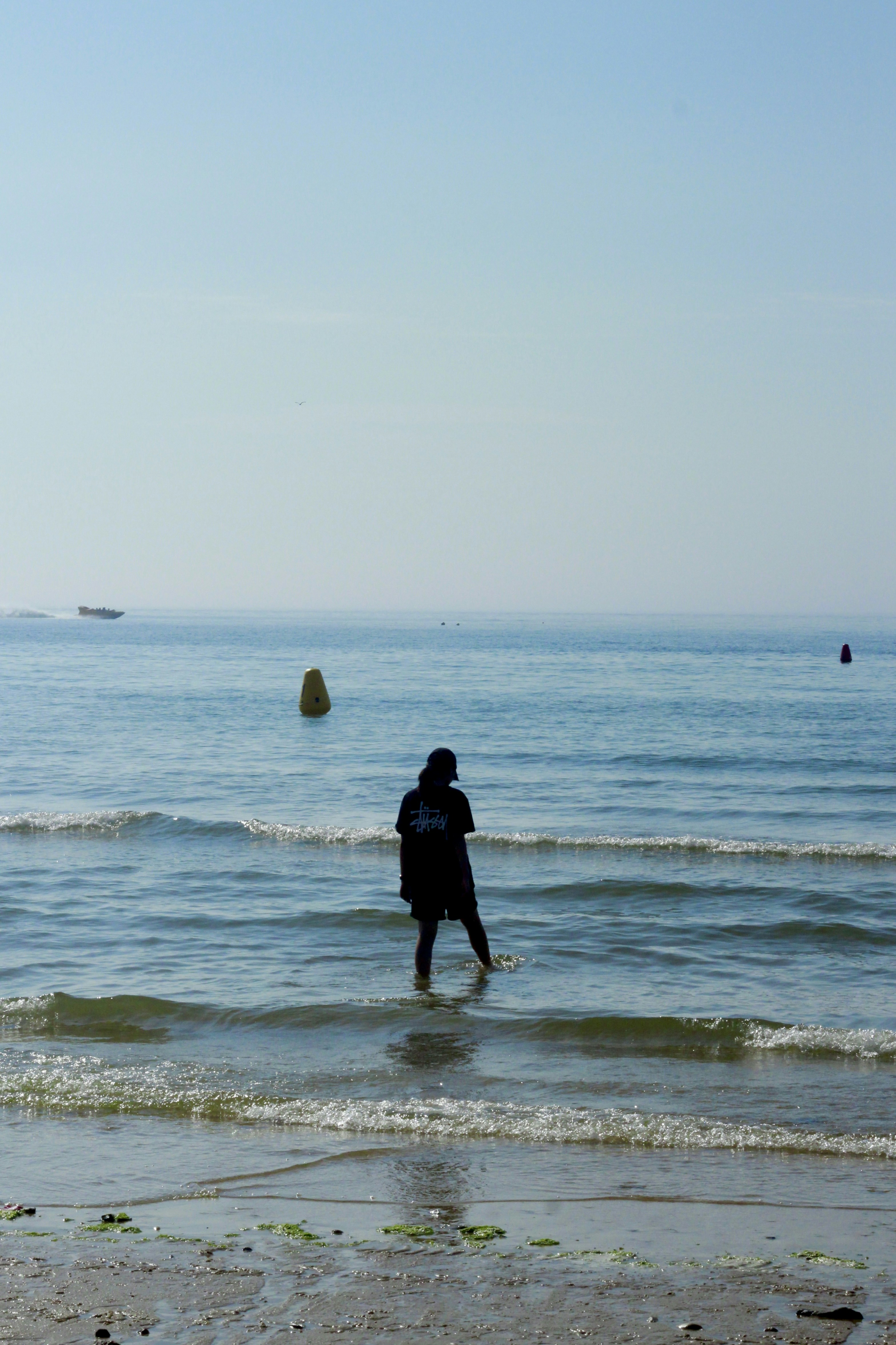  lone figure at the shoreline embracing the horizon