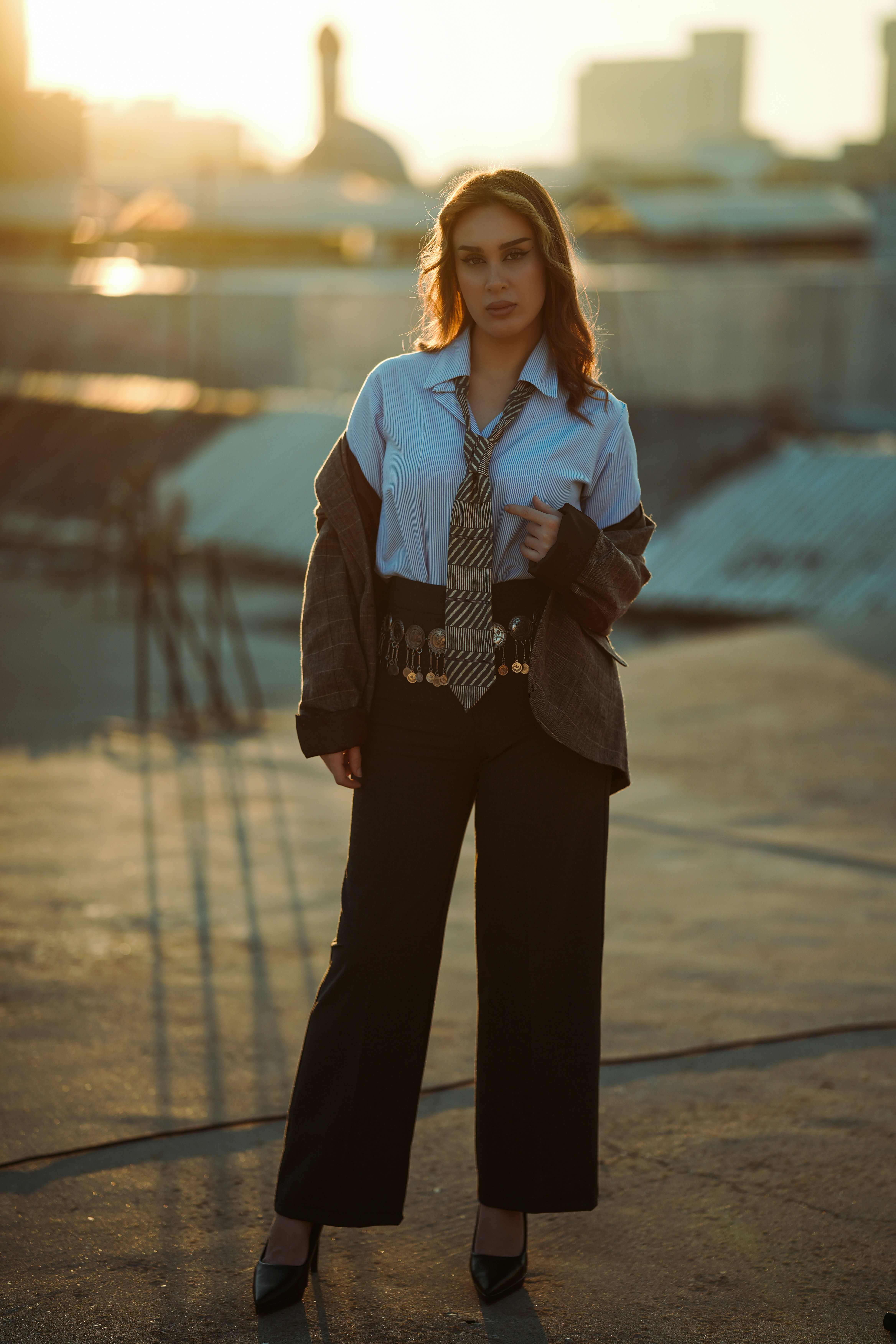 Rooftop Confidence: A Sunlit Portrait in Street-style Attire