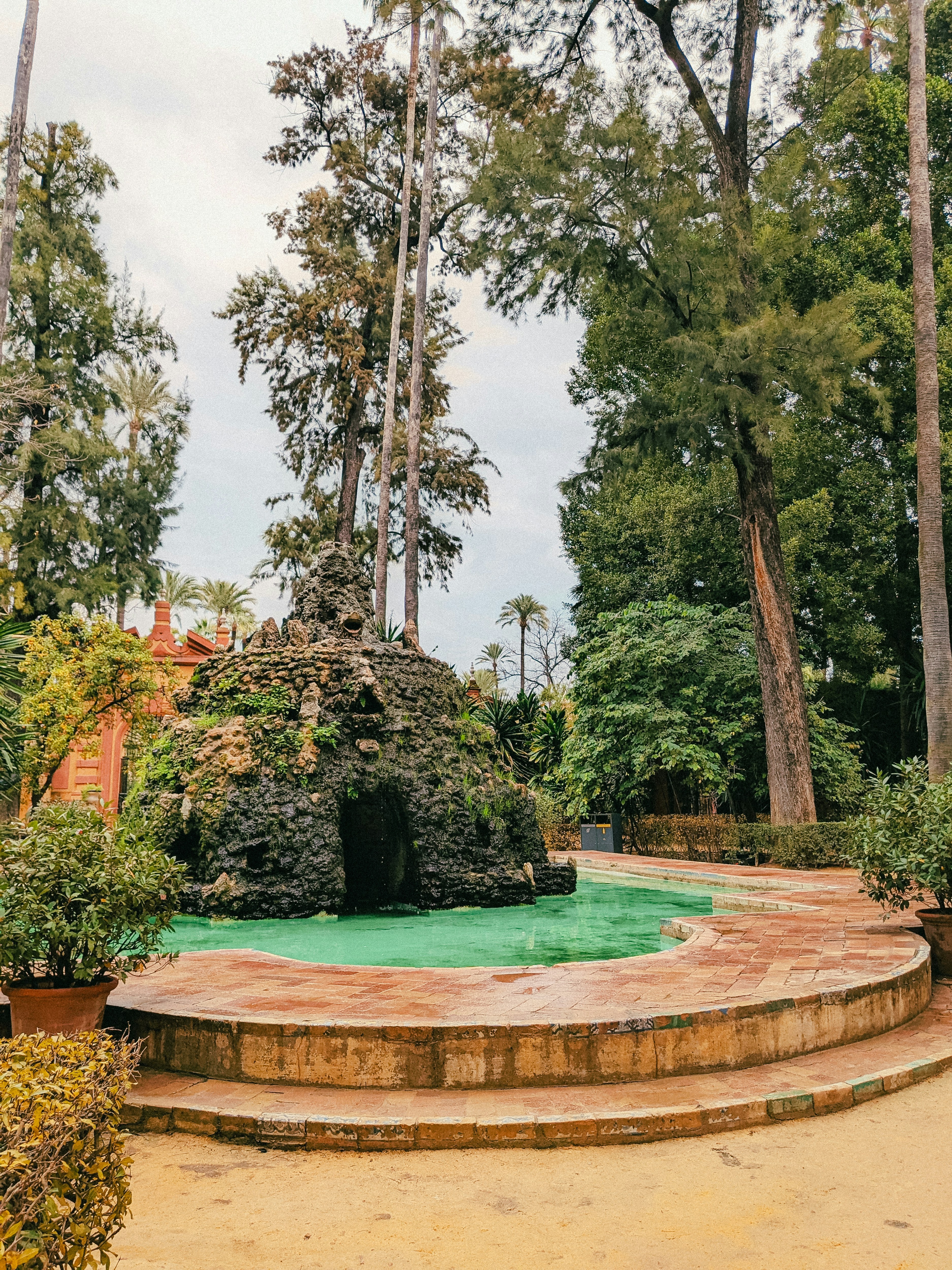 Hidden Fountain Ruins Beneath Towering Oaks