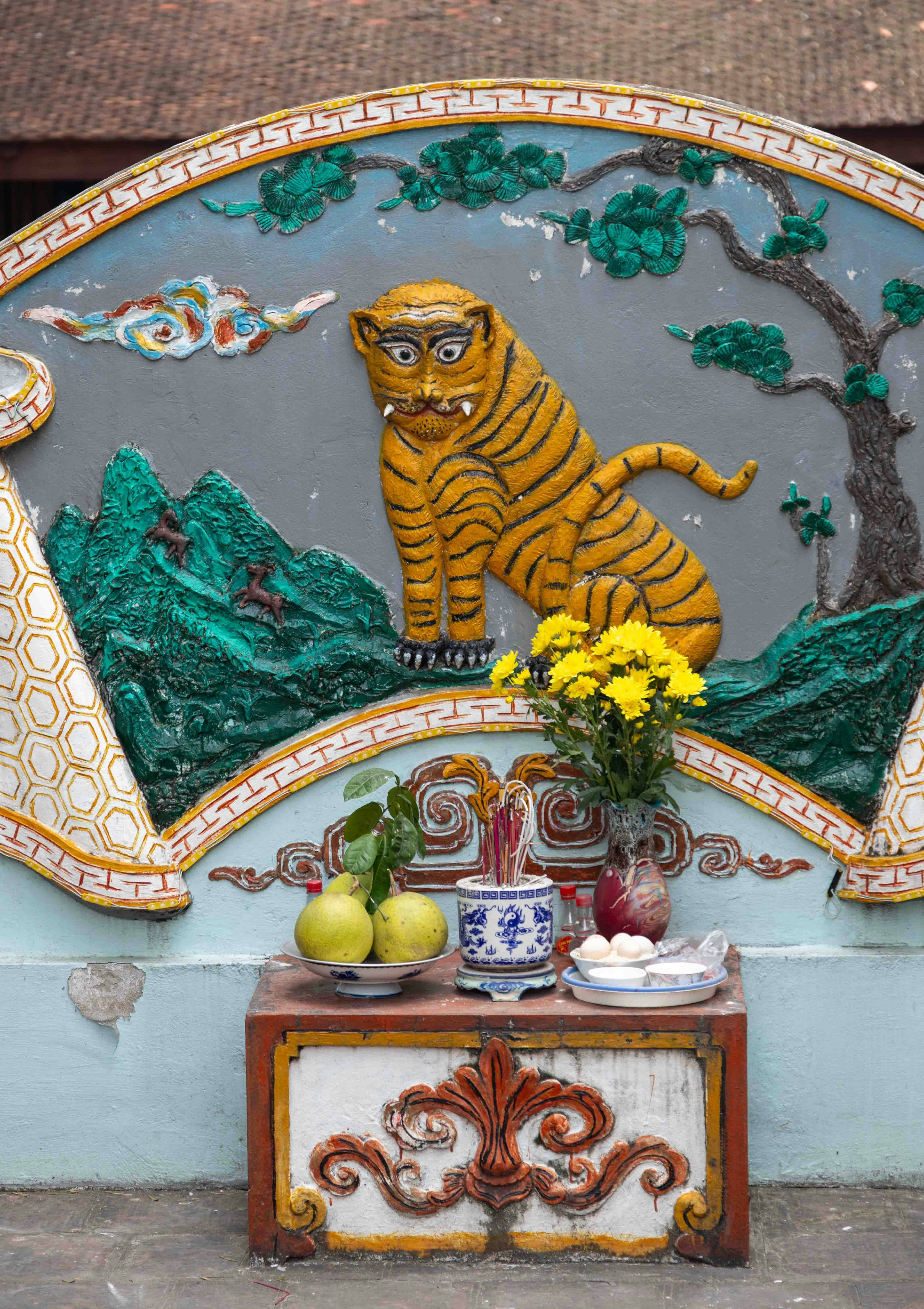Tiger Guardian: A Colored Altar Scene with Fresh Offerings