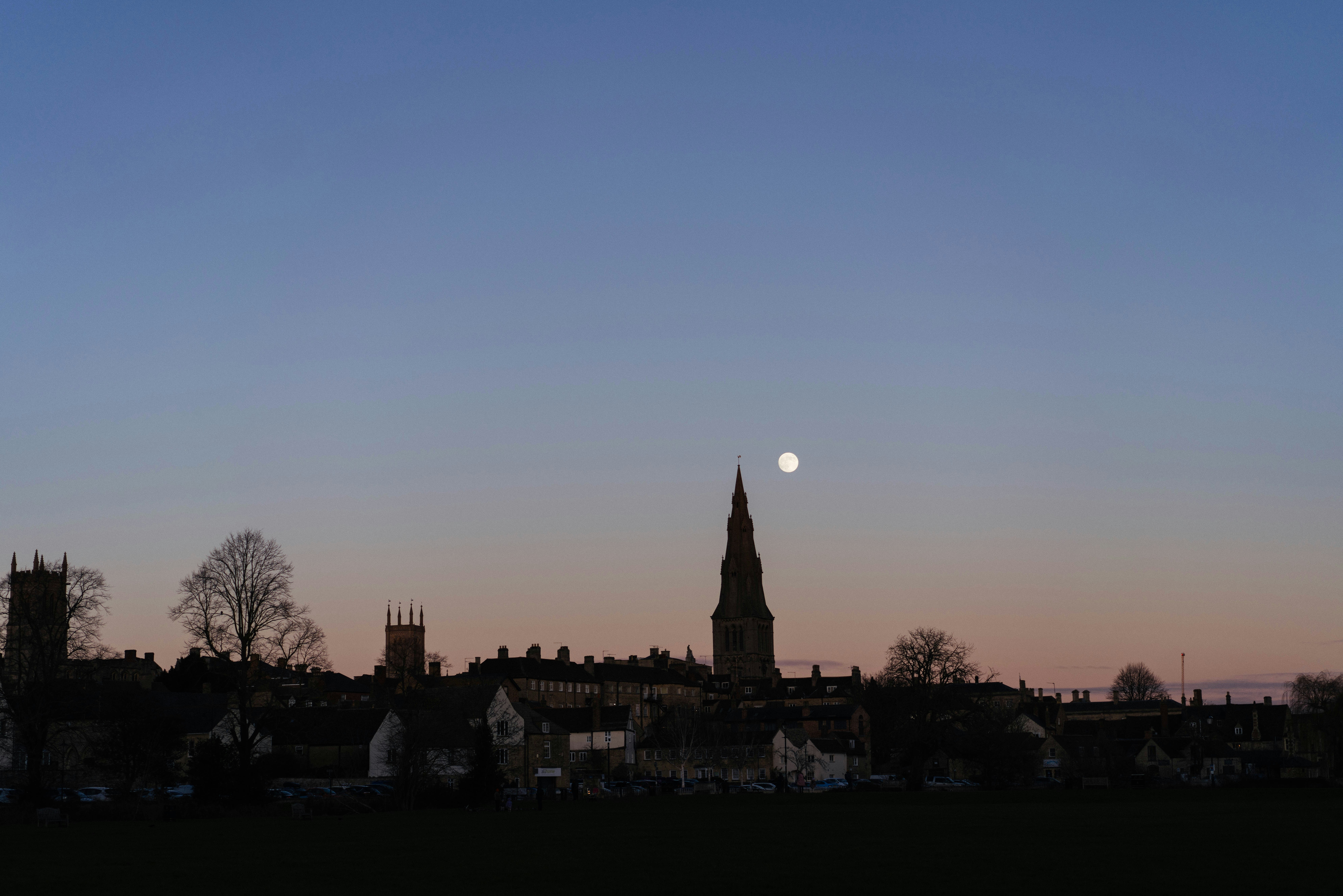Moon Over a Quiet Town: Dusk on the Silhouette Row