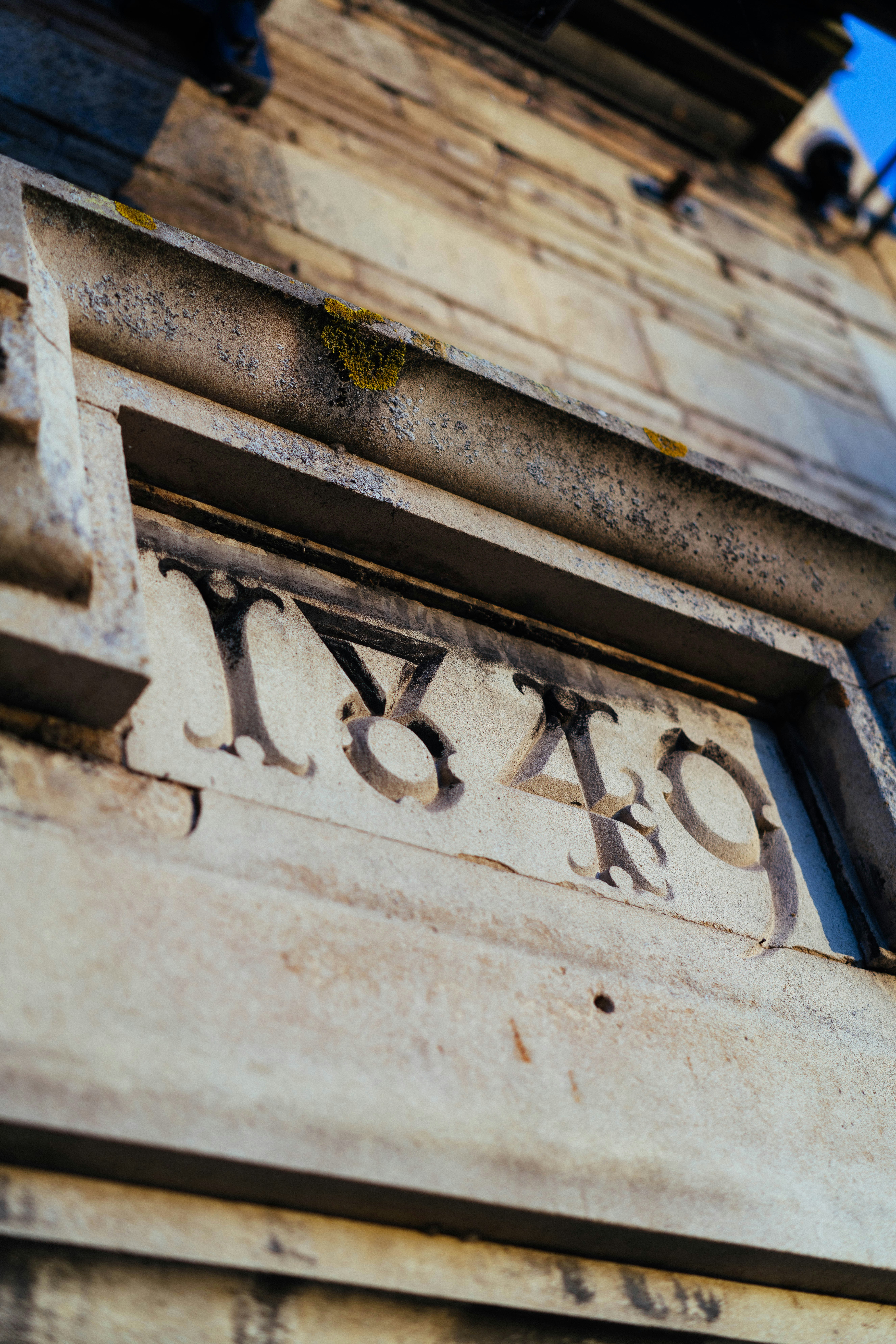 Weathered stone inscription: 1740 Carved into time