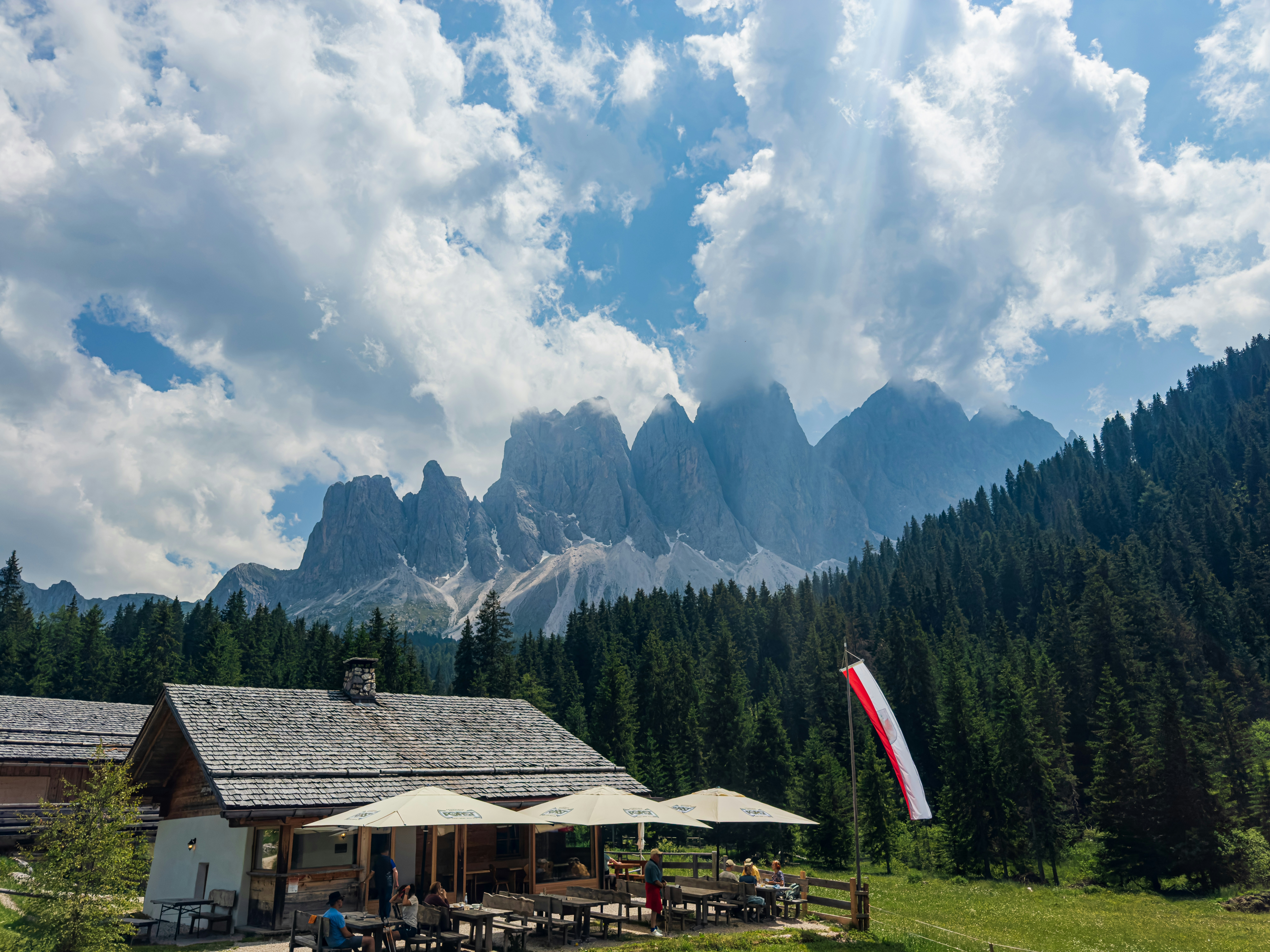Alpine Terrace Under Cloud-Carved Peaks