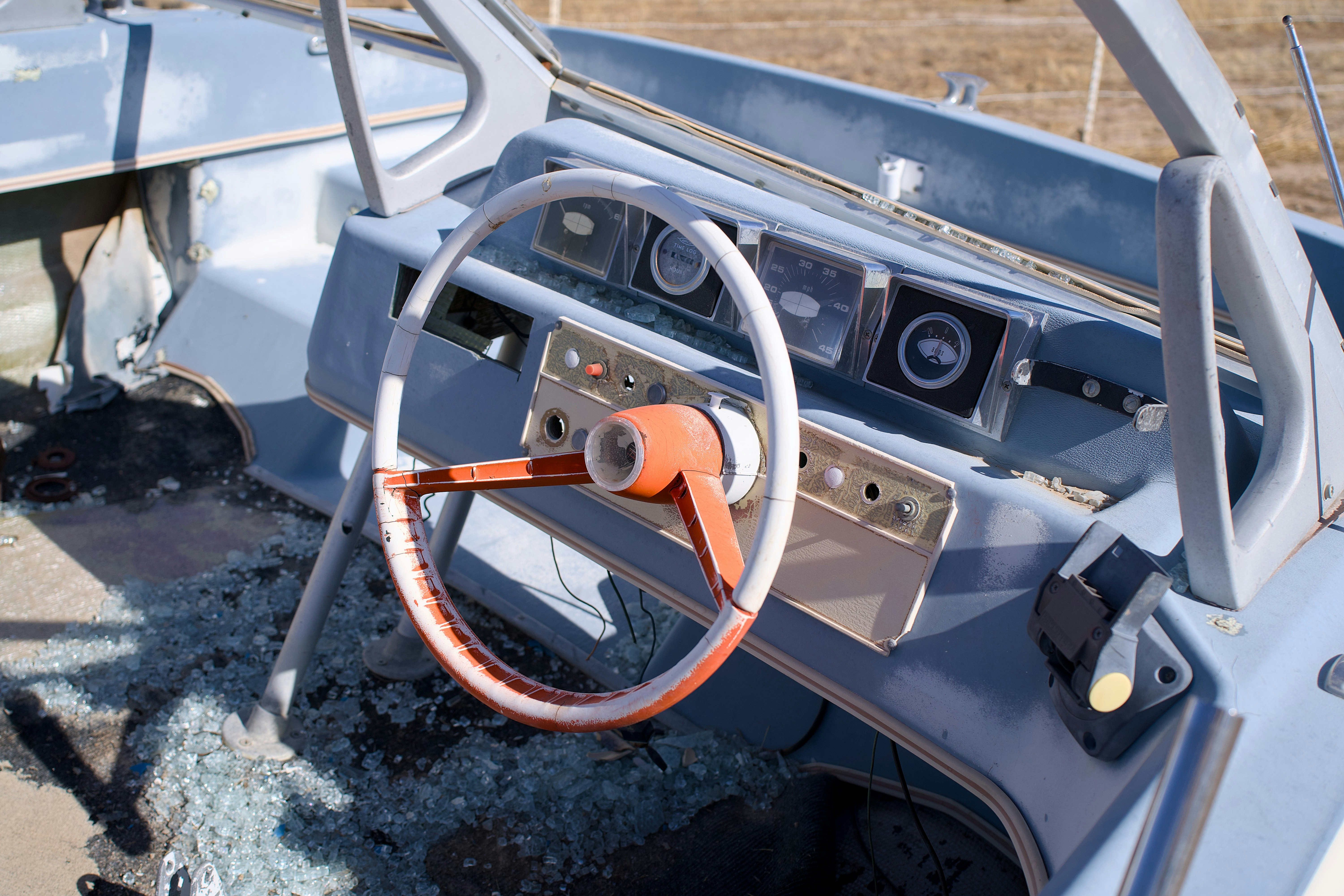 Deserted Dashboard: A Rusted Sail of Past Rides