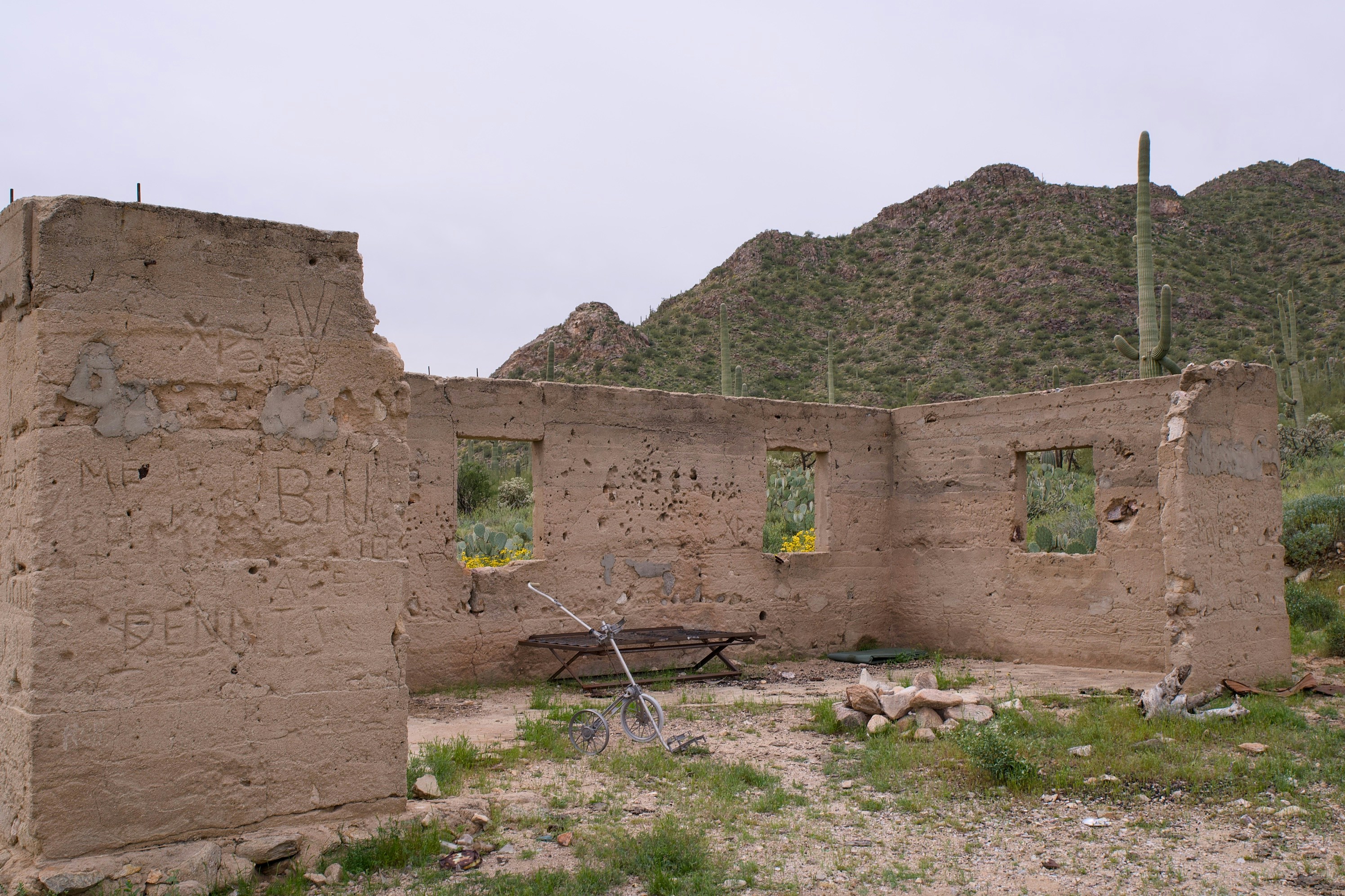 Desert Ruin Panorama: Weathered Walls and Desert Horizon