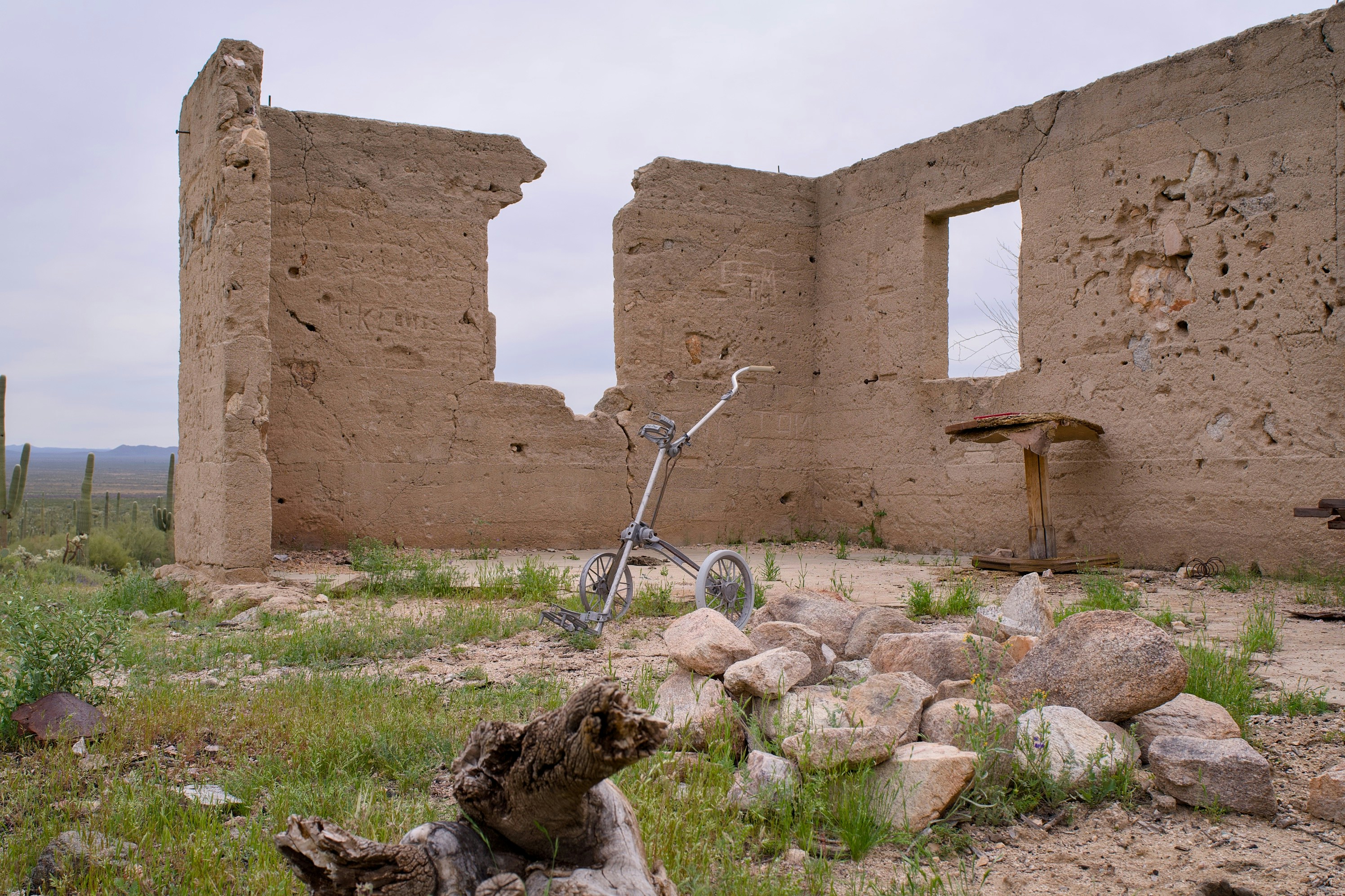 Remnant Dunes: A Cyclist's Quiet Ruin in the Desert