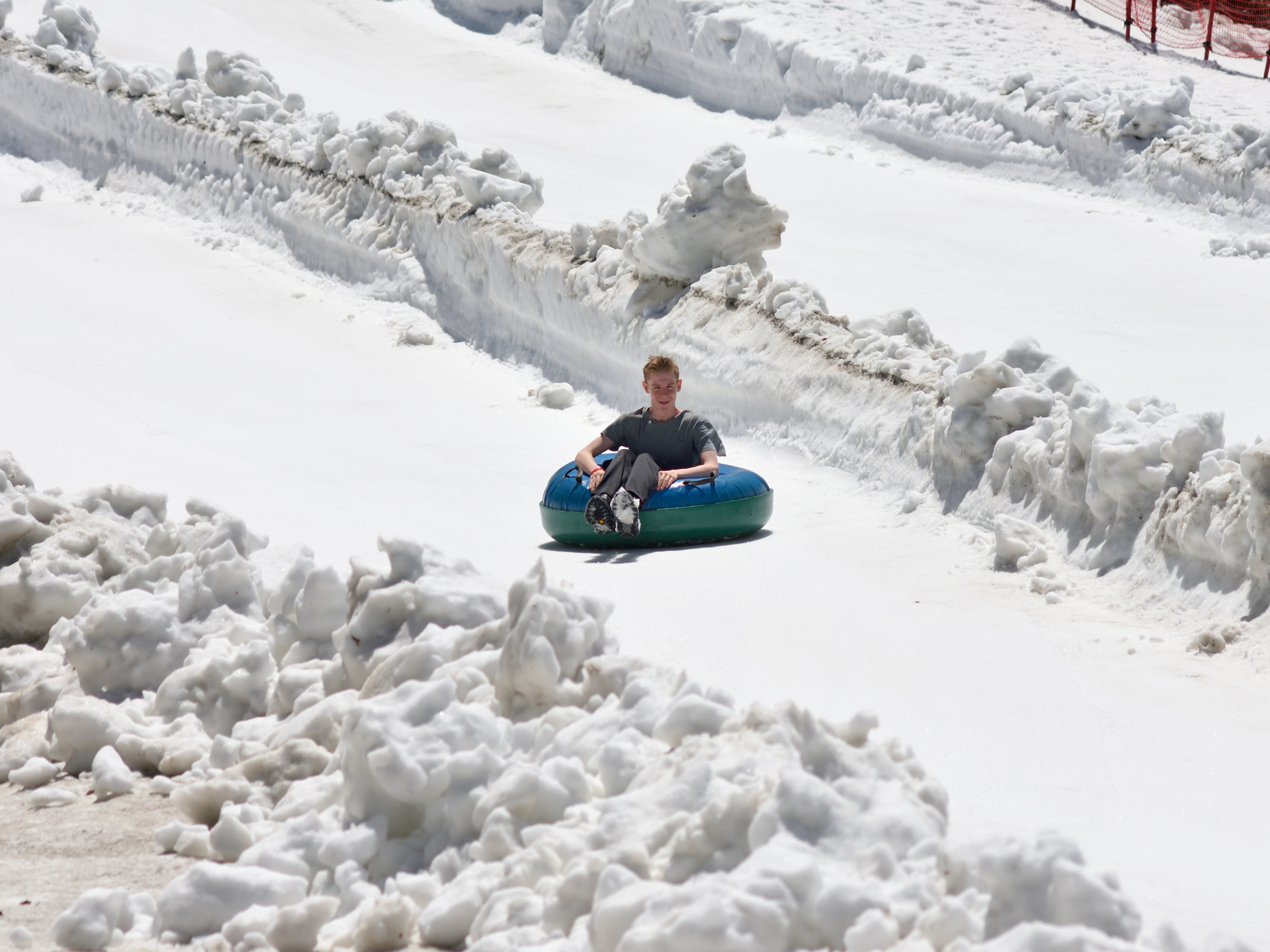Tubing Across a Snowy Slope