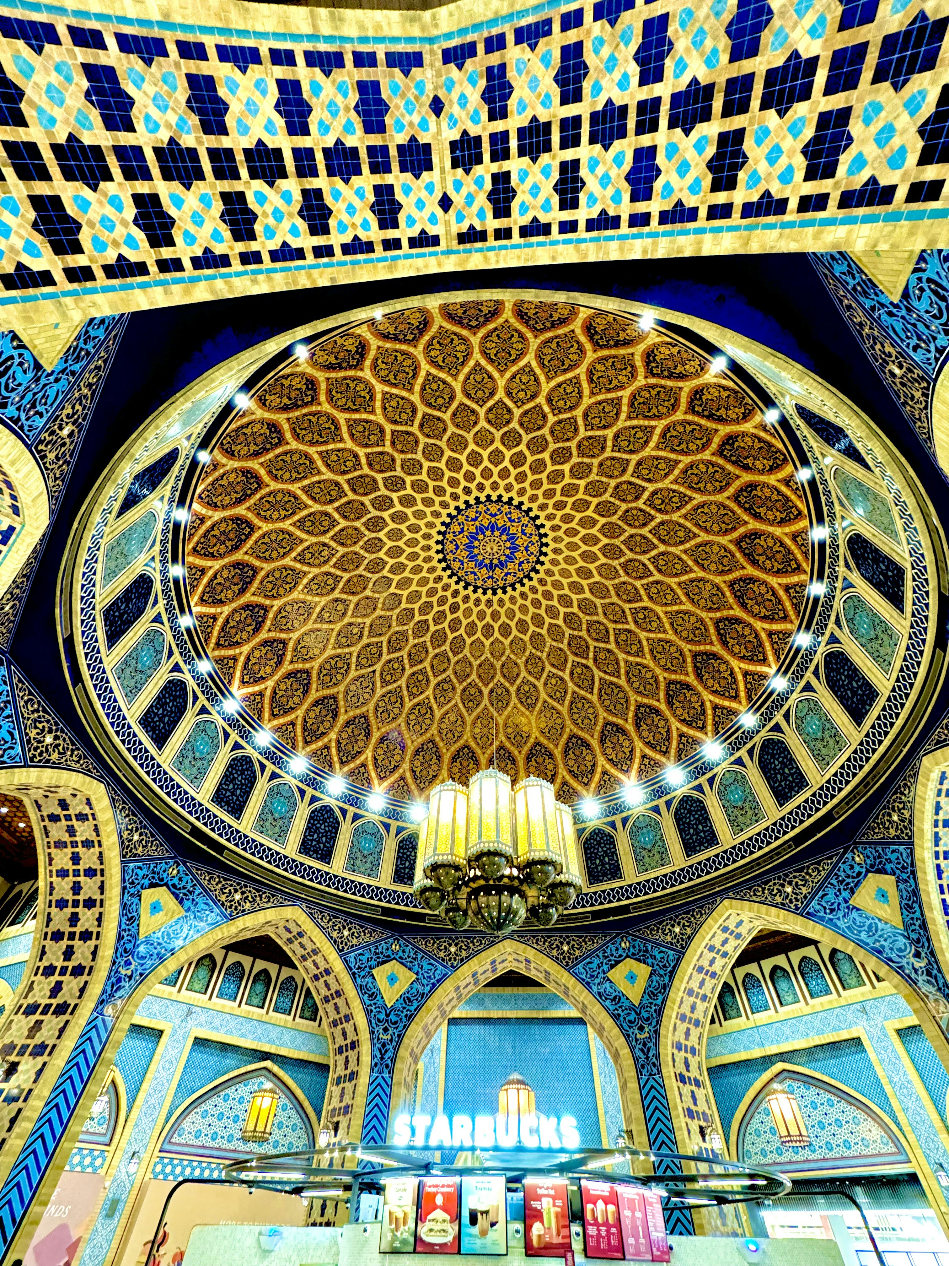 Symmetrical Golden Dome Above Starbucks Arcade