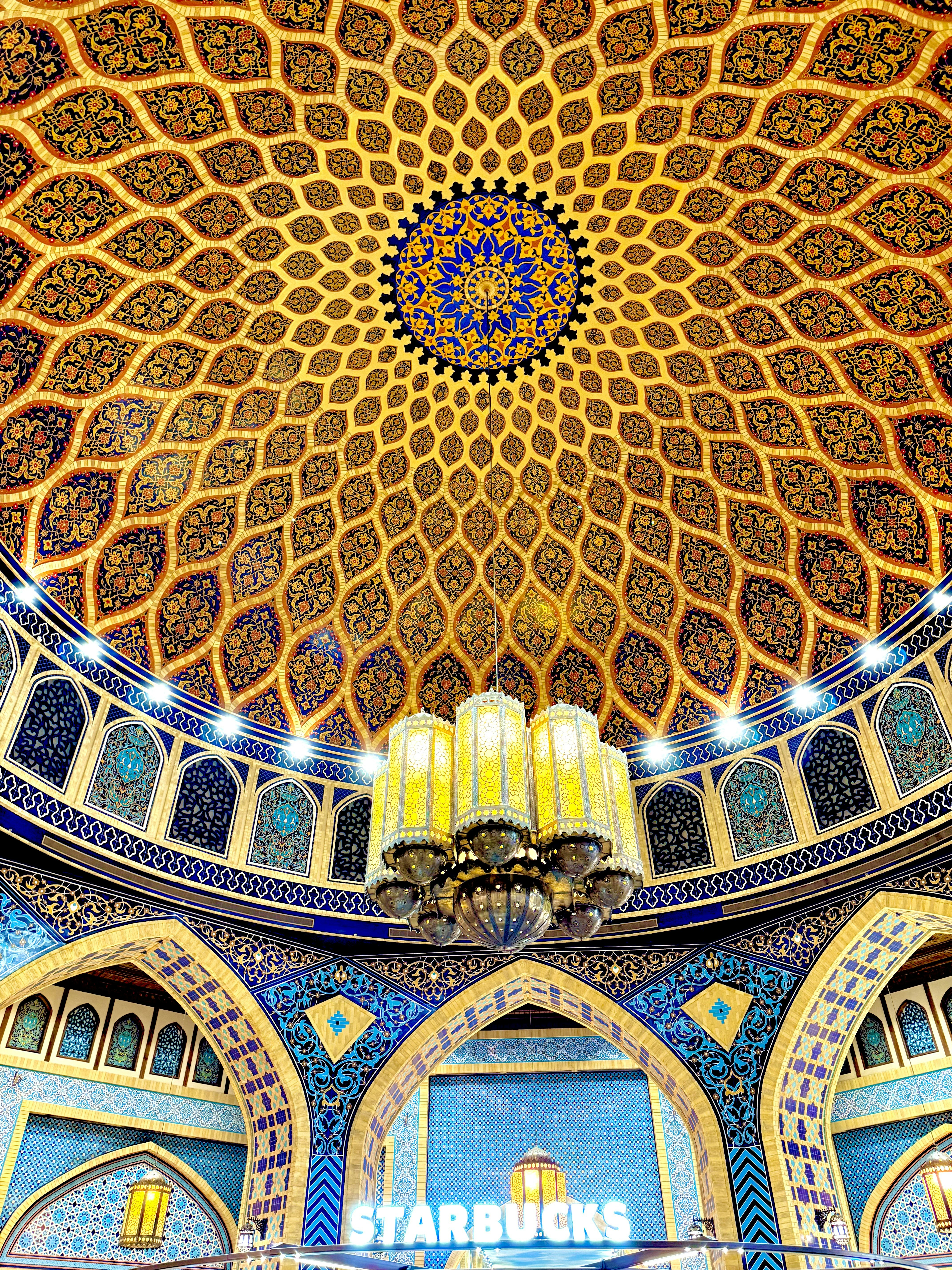 Illuminated Geometric Dome Over Starbucks Arcade