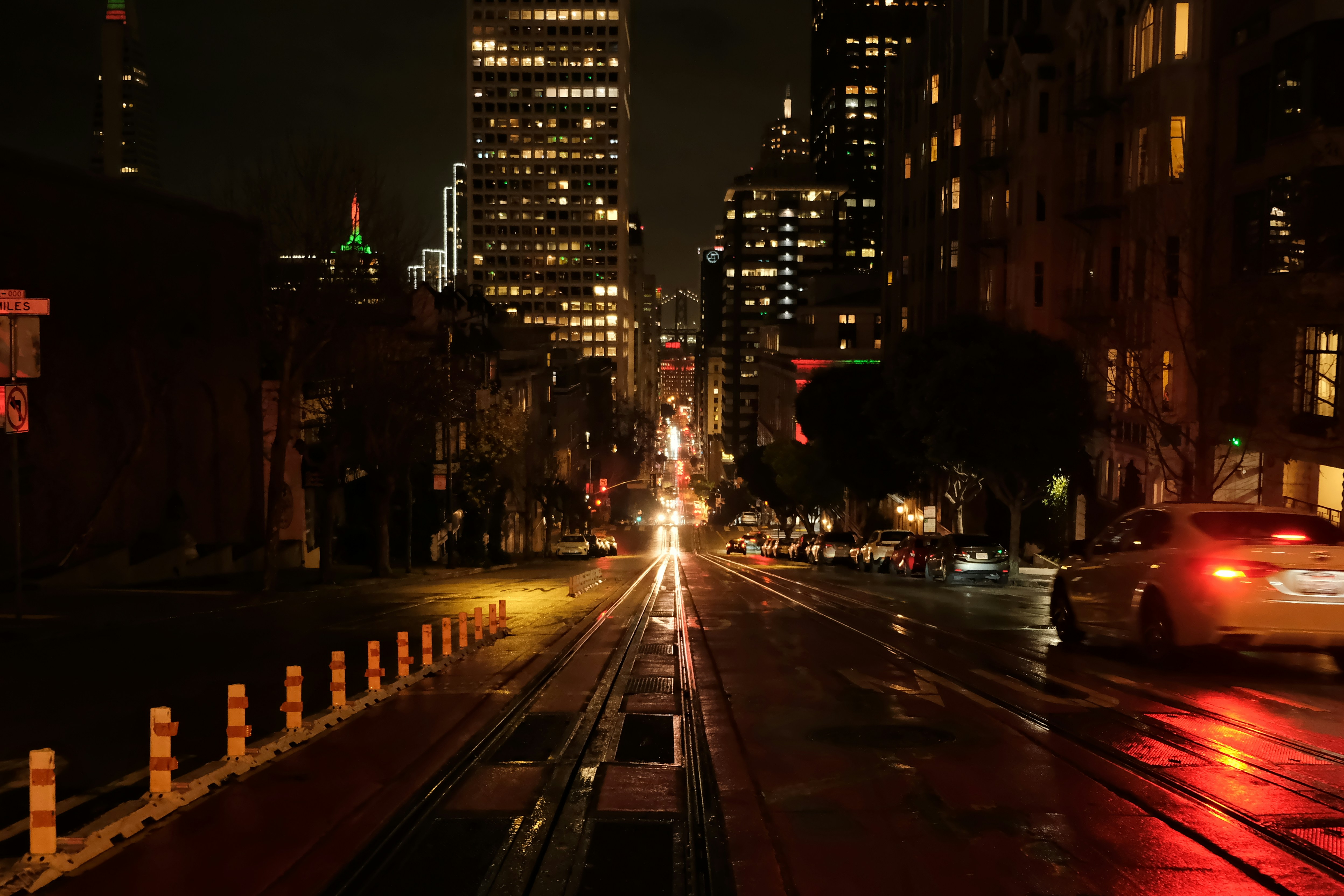 Night Roadline: City Lights Draw the Tracks