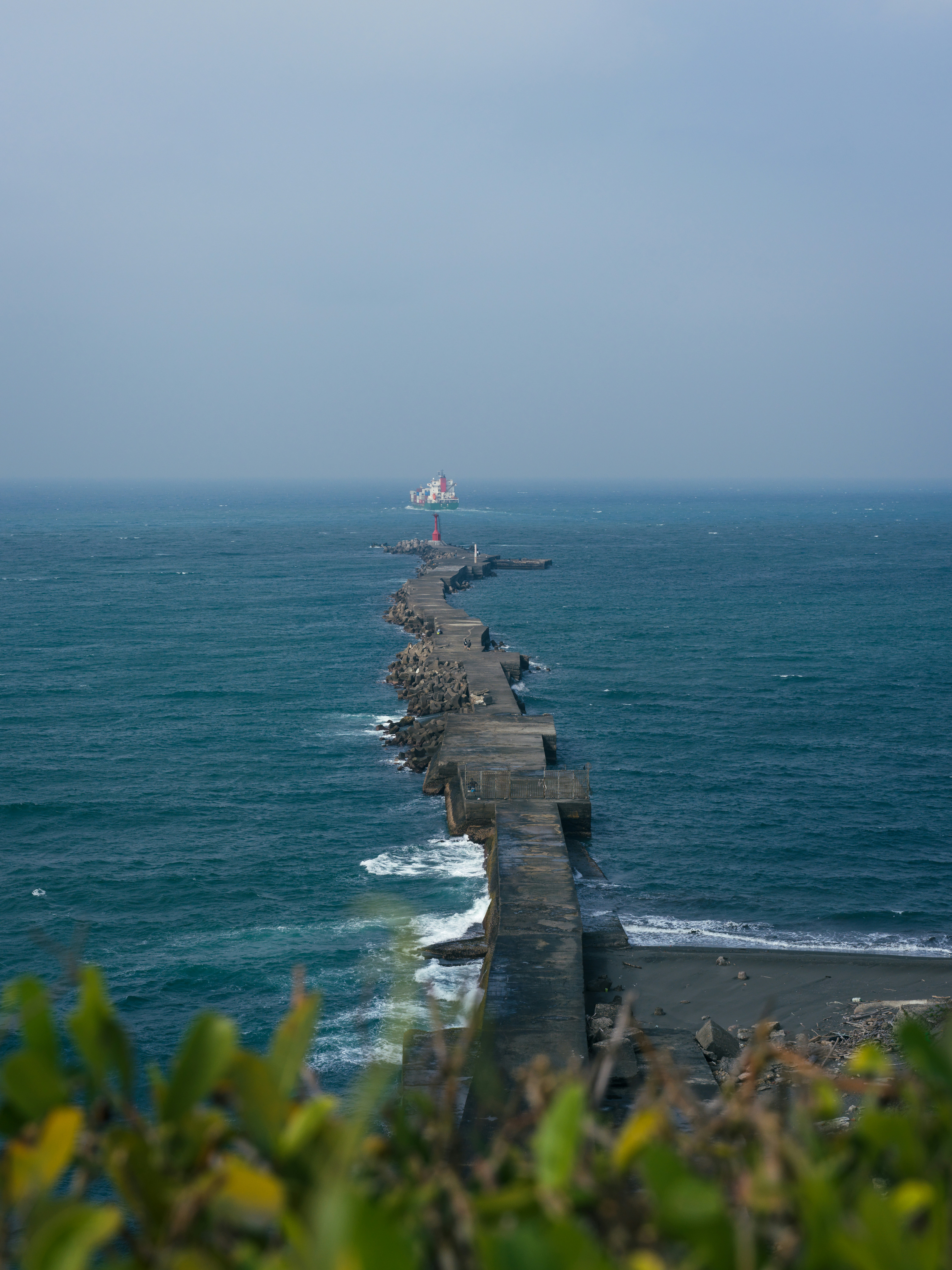 Tidal Wayfarer: A Stone Pier Reaches the Open Sea