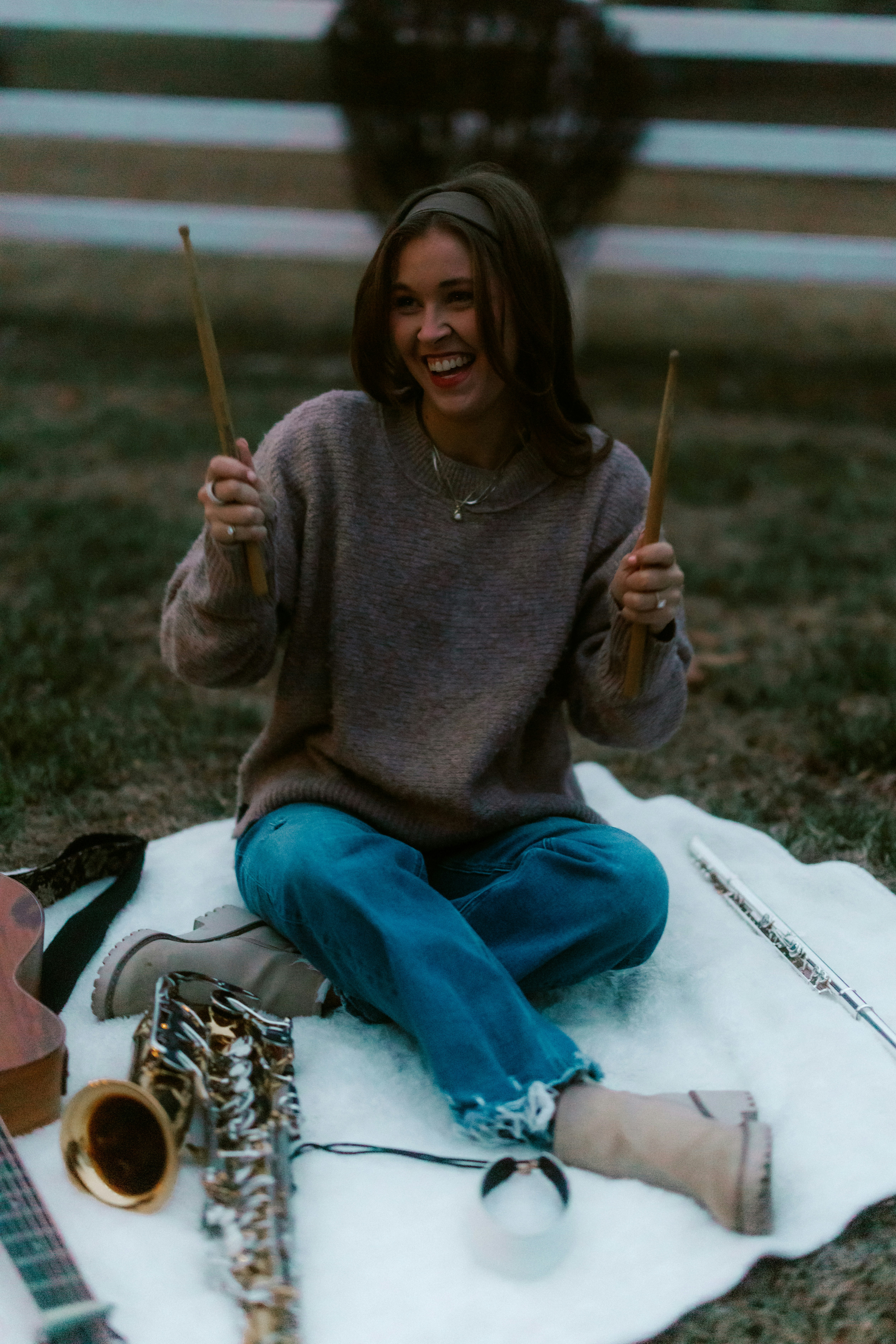 Joyful Serenade: A Girl with Drums in a Cozy Outdoor Moment