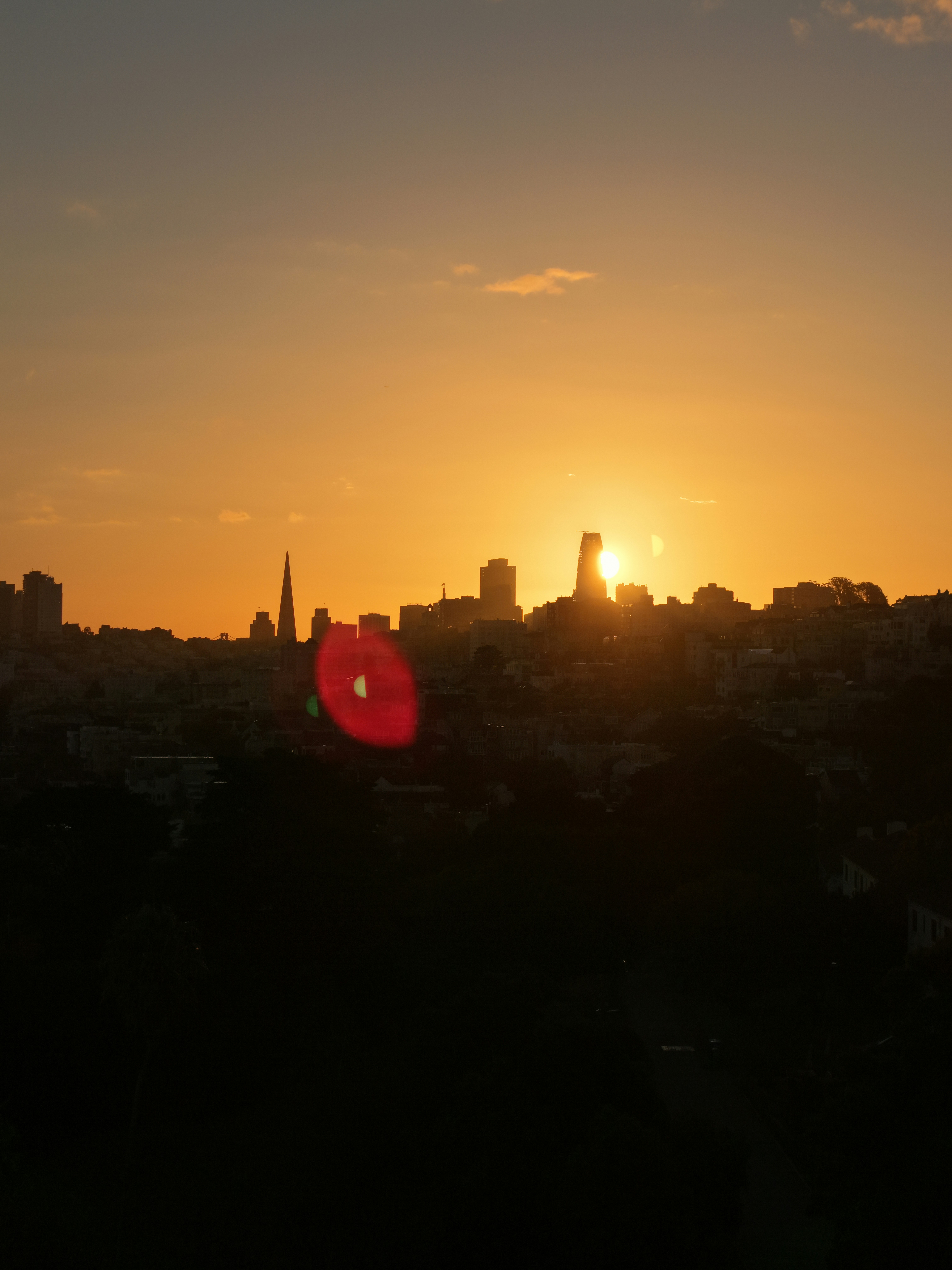 Golden Hour Over the City: Silhouetted Skyline at Sunset