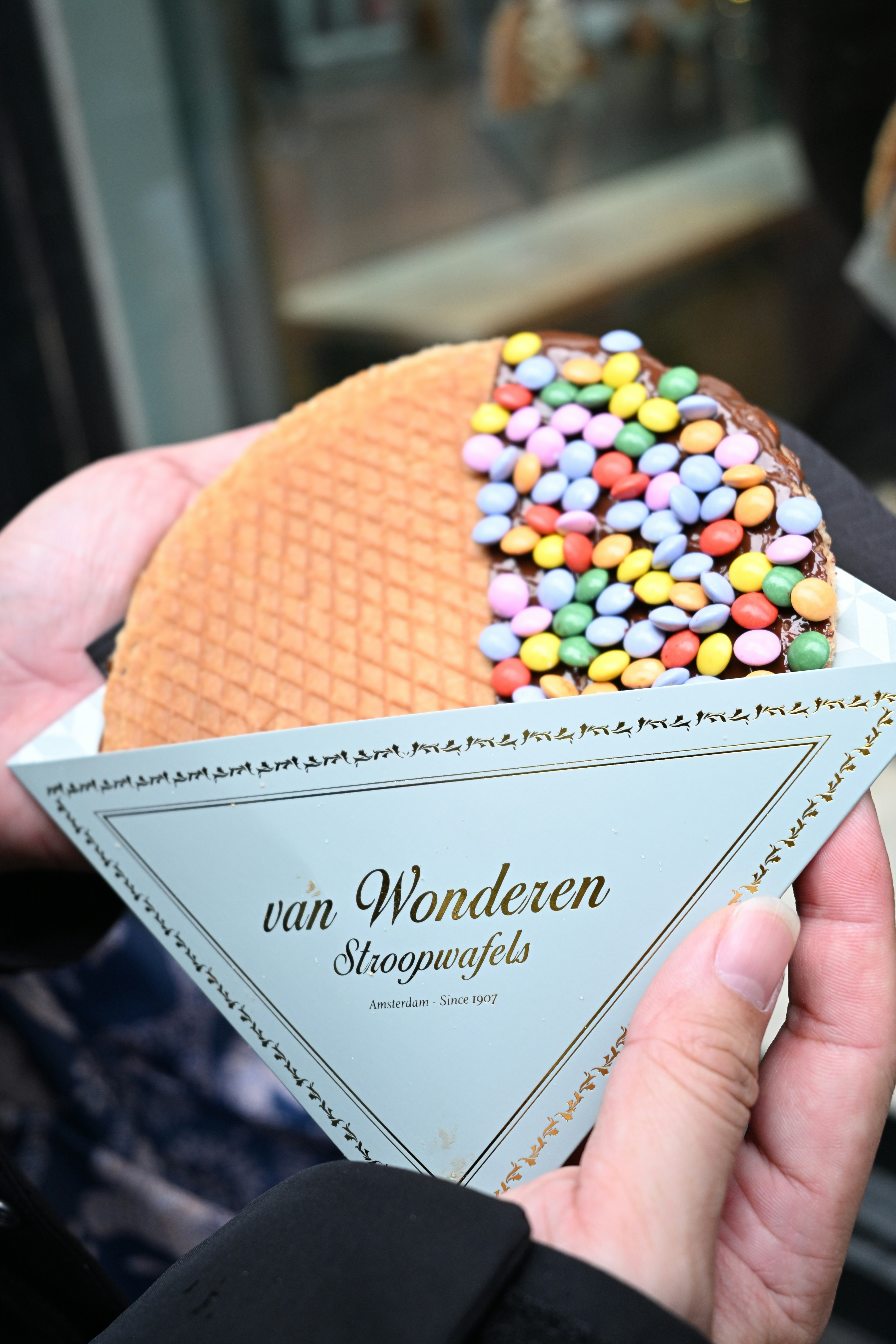 Candy-coated bite: a half-dipped ice cream cone in a branded wrapper