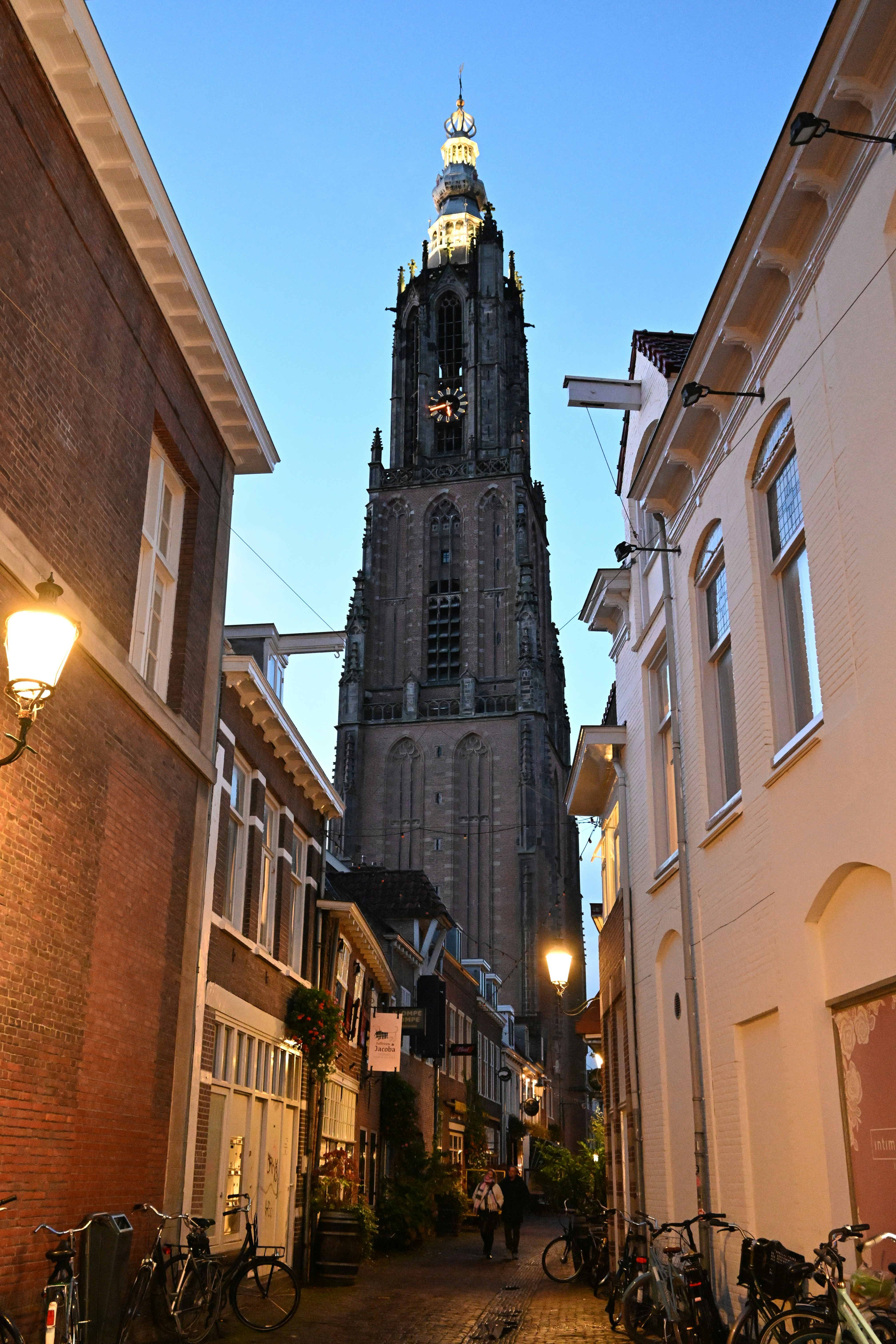 Towering Cathedral Looms Over Narrow Dutch Street