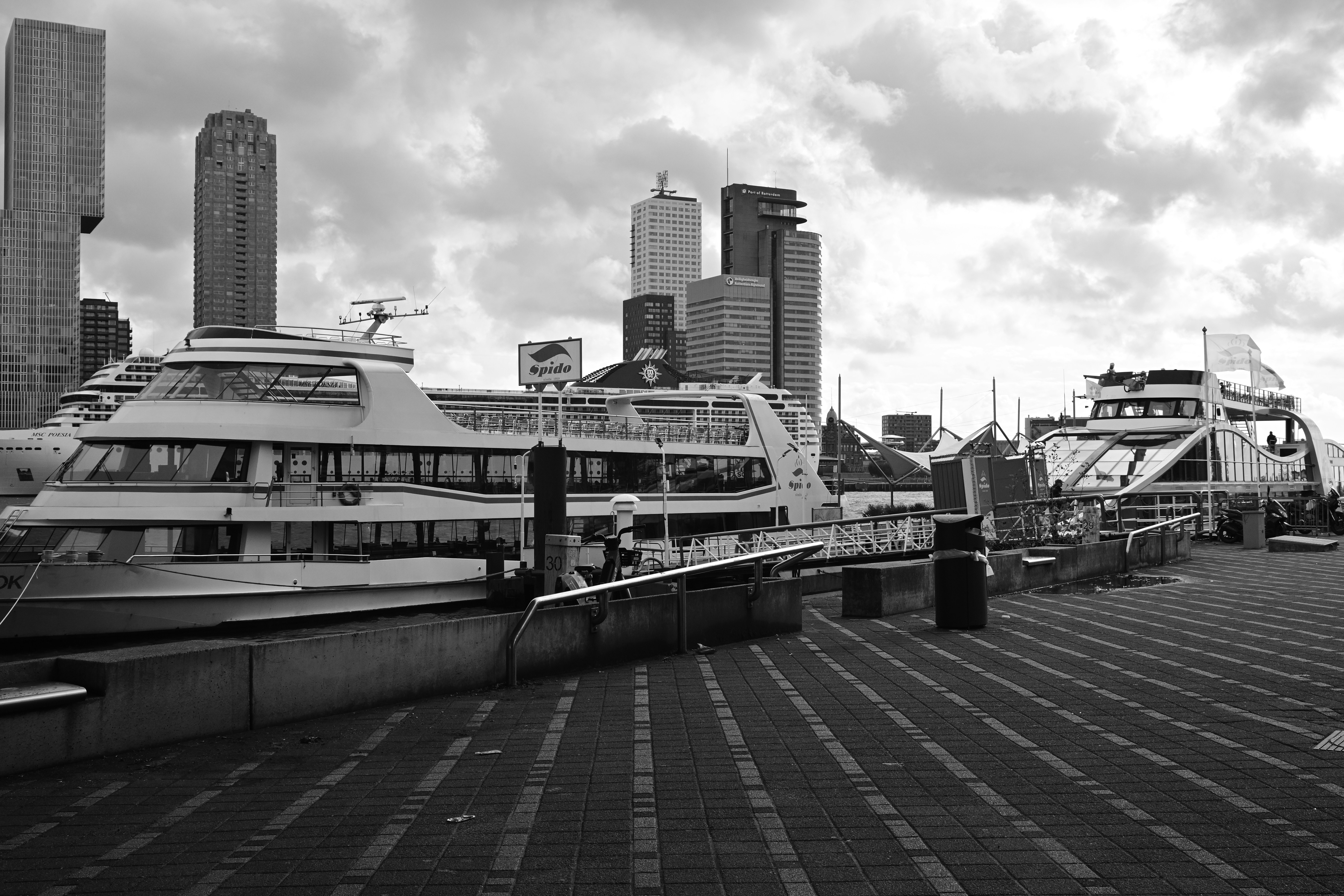 Harborfront Silhouettes: Boats and Skyscrapers at Dusk