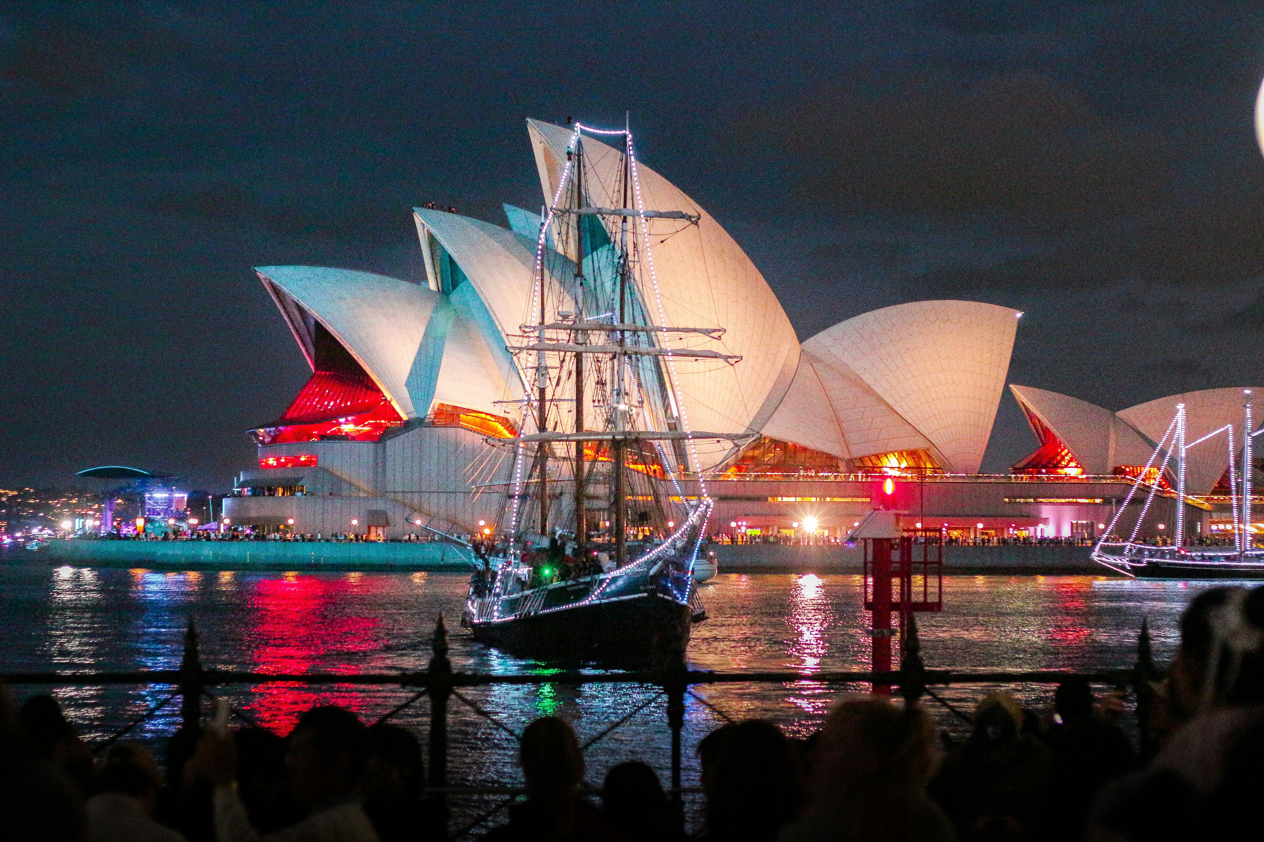 Neon Reflections on a Night Tour: The Opera House from the Foreground