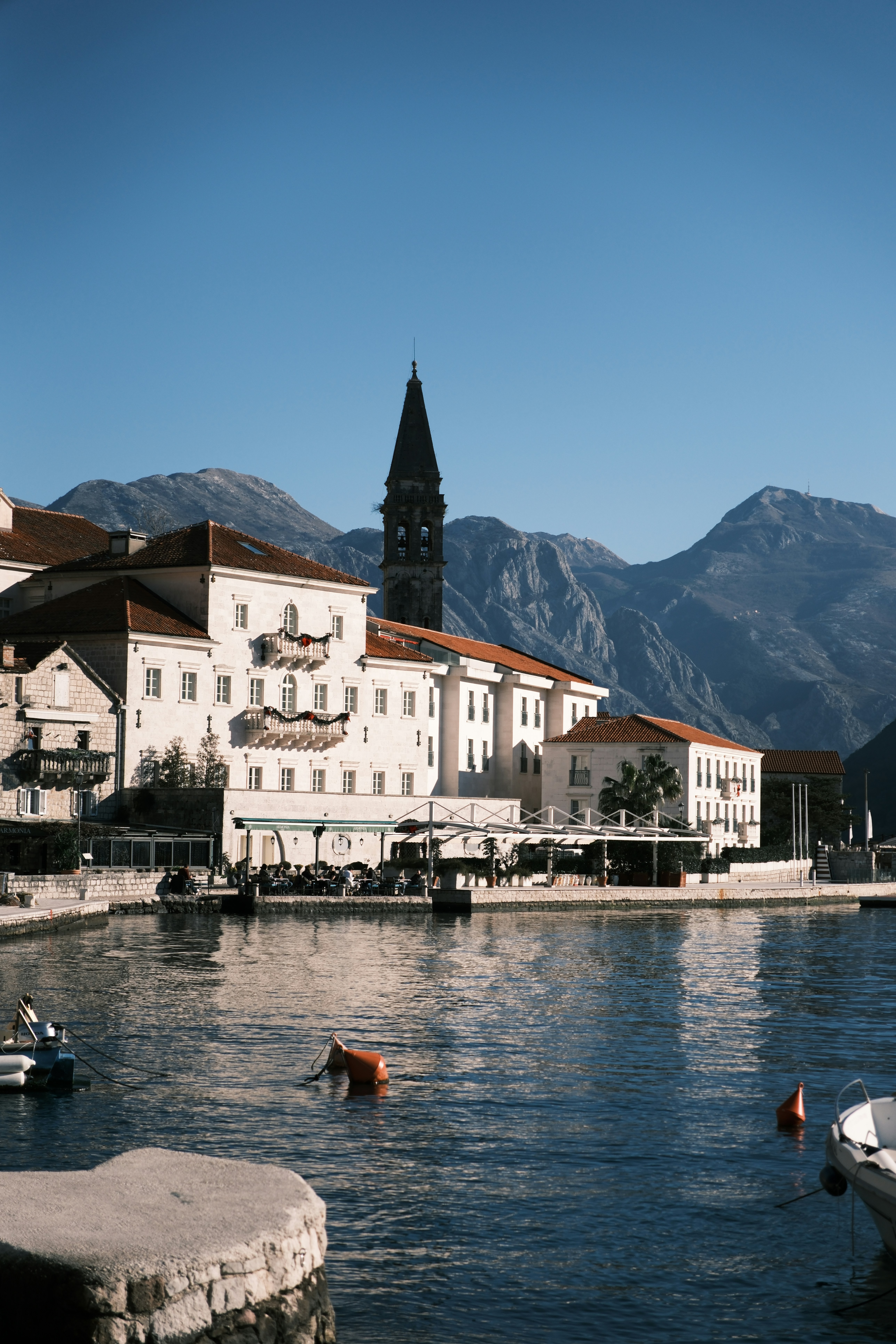 Harbor Town with Alpine Backdrop and Clock Tower